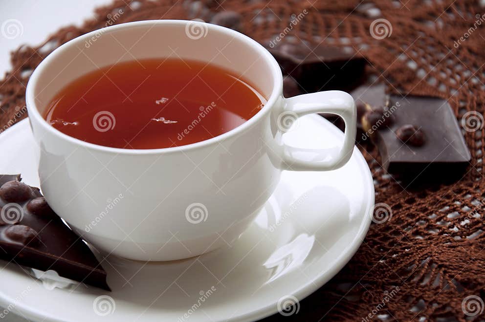 Cup of tea with chocolate stock image. Image of delicious - 37494041