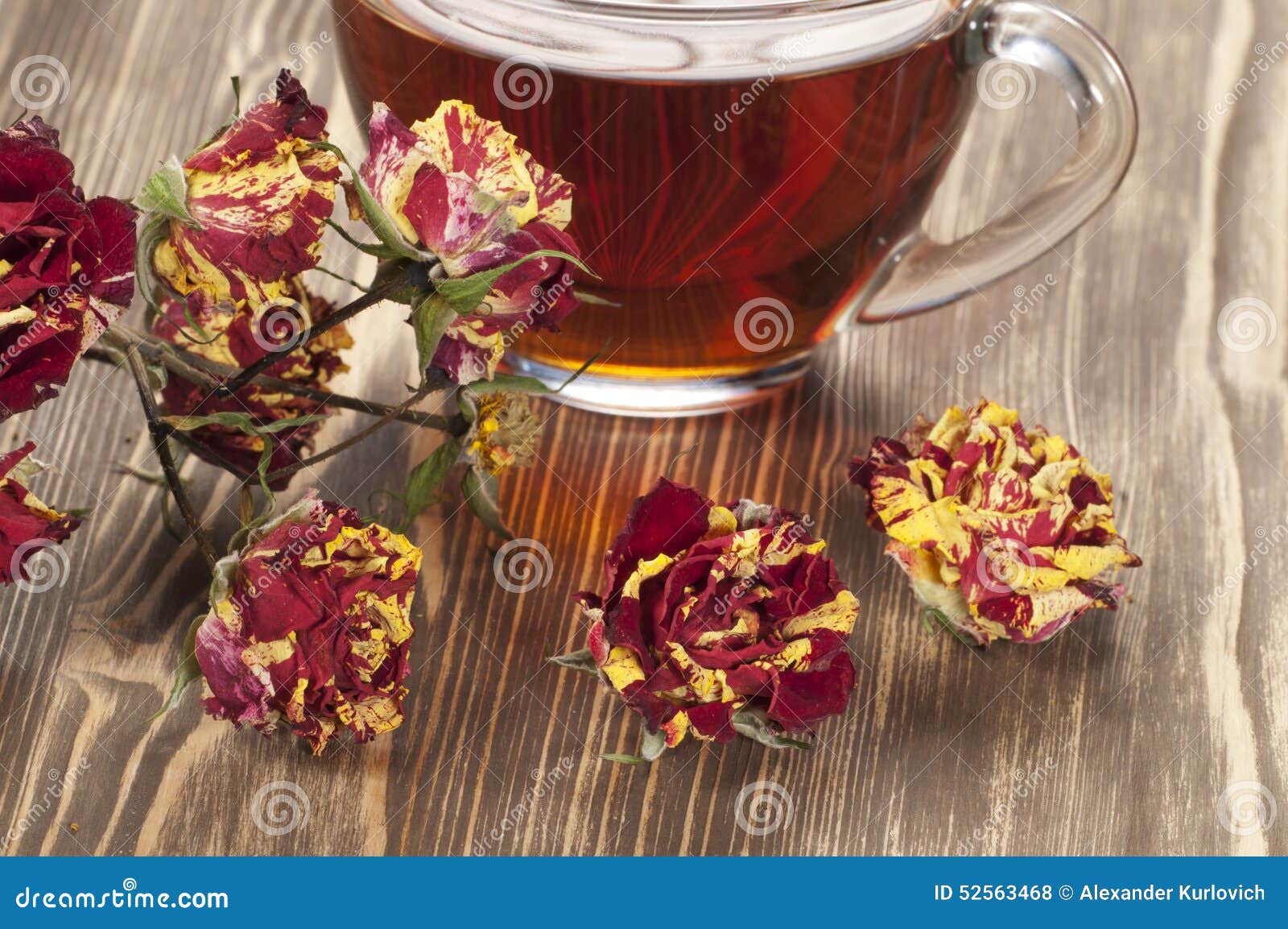 Cup of tea and dry roses stock photo. Image of beauty - 52563468