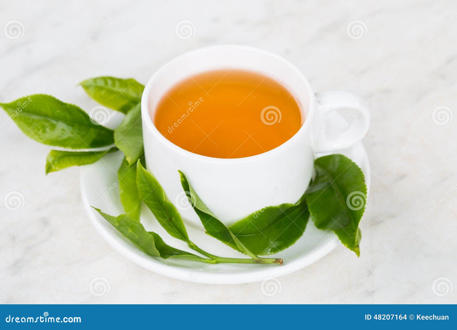 Cup of Tea with Fresh Tea Leafs Stock Photo - Image of freshness, brown ...