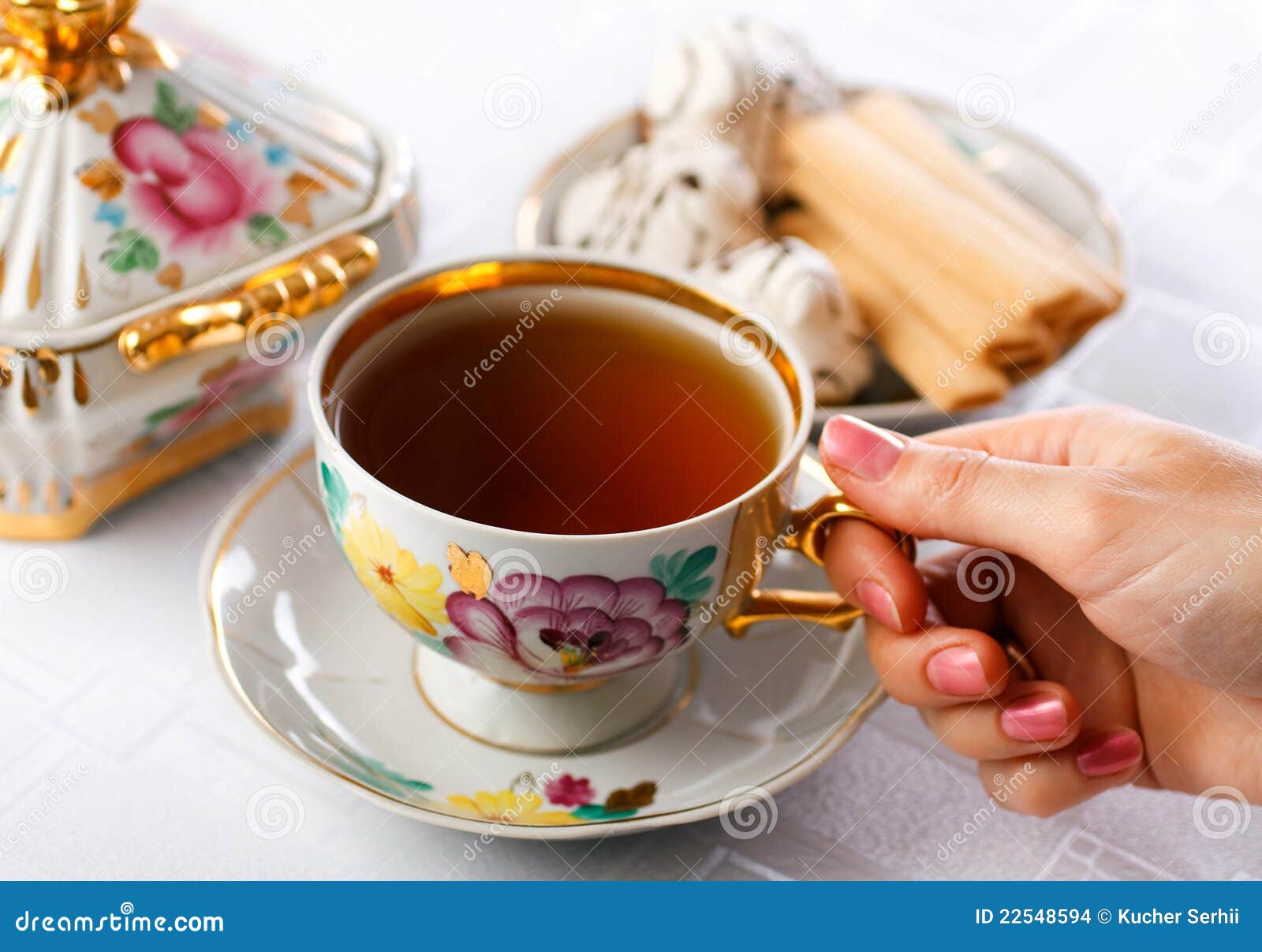 Cup of tea in hand stock photo. Image of lifestyle, drink - 22548594