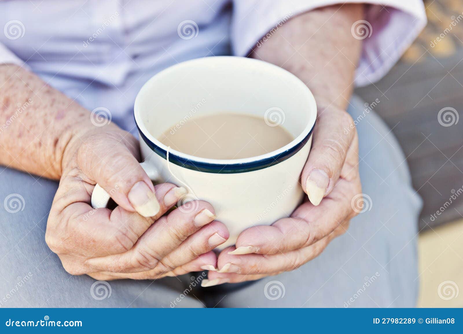 Cup of tea in hands stock image. Image of person, drink - 27982289