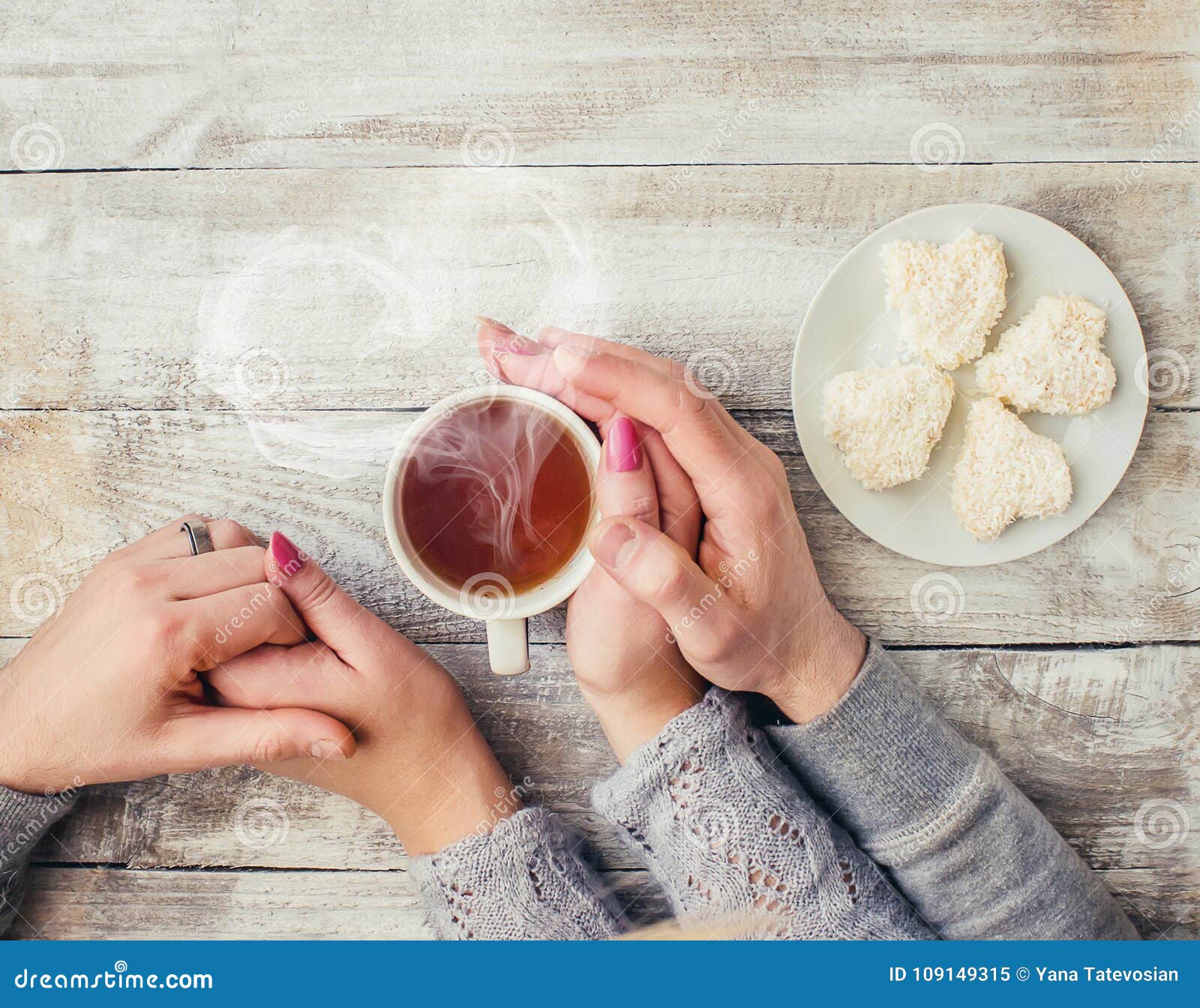 A Cup of Tea in the Hands of a Man and a Woman. Stock Image - Image of ...