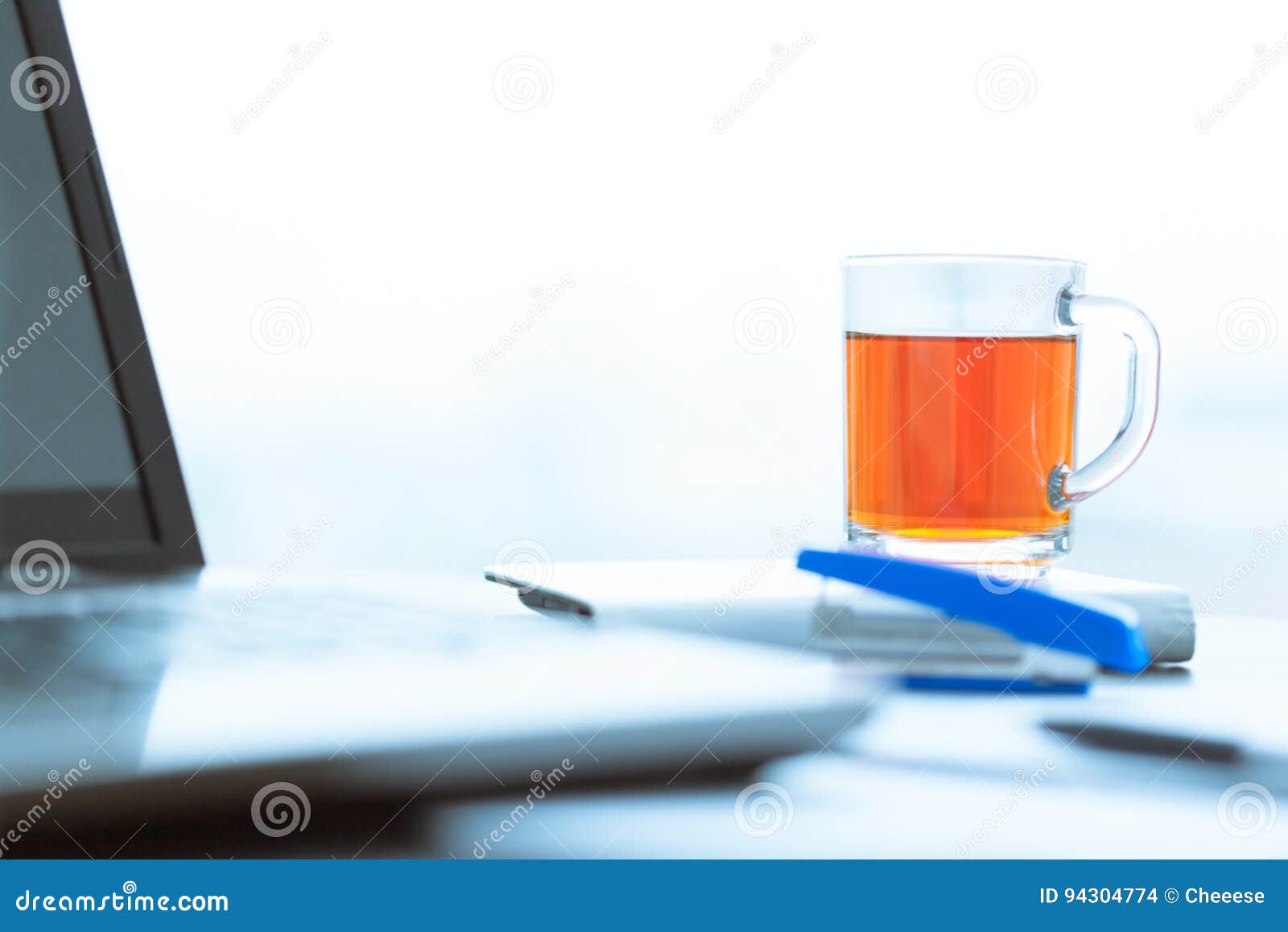 A cup of tea on a laptop stock photo. Image of open, break - 94304774