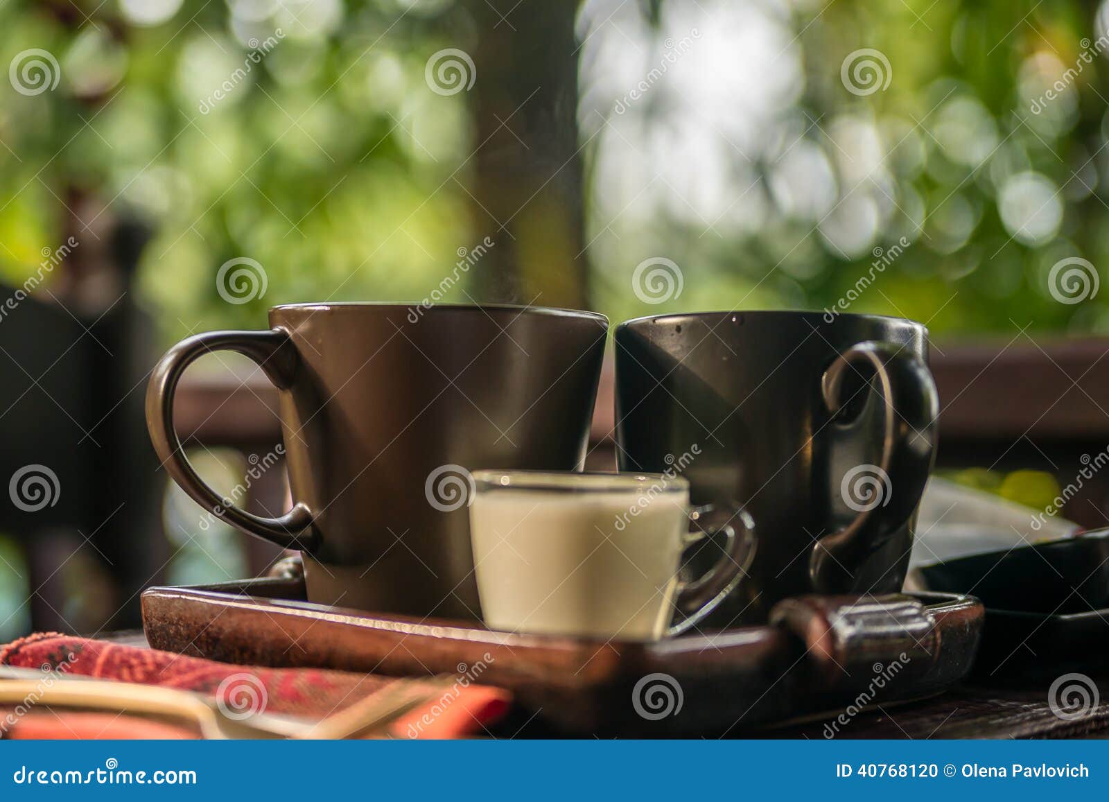 Cup of Tea with Milk Outdoors Stock Photo - Image of napkin, light ...