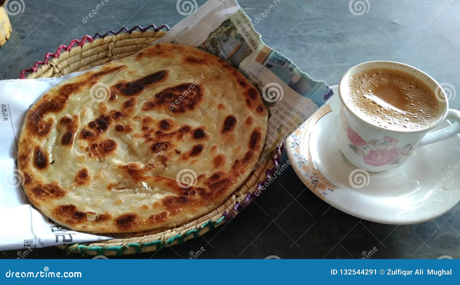A cup of tea and Paratha stock image. Image of table - 132544291