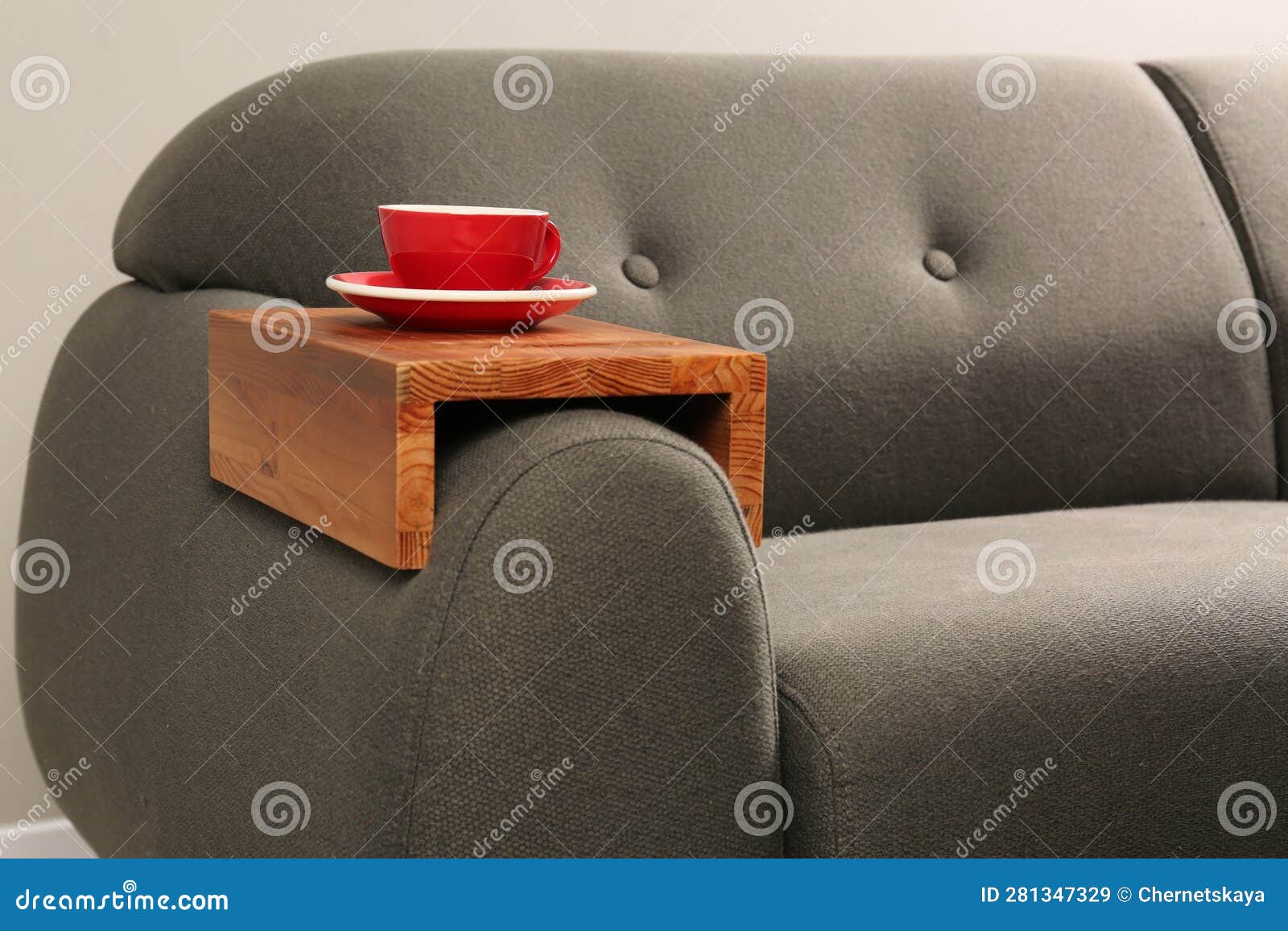 Cup of Tea on Sofa with Wooden Armrest Table in Room. Interior Element ...
