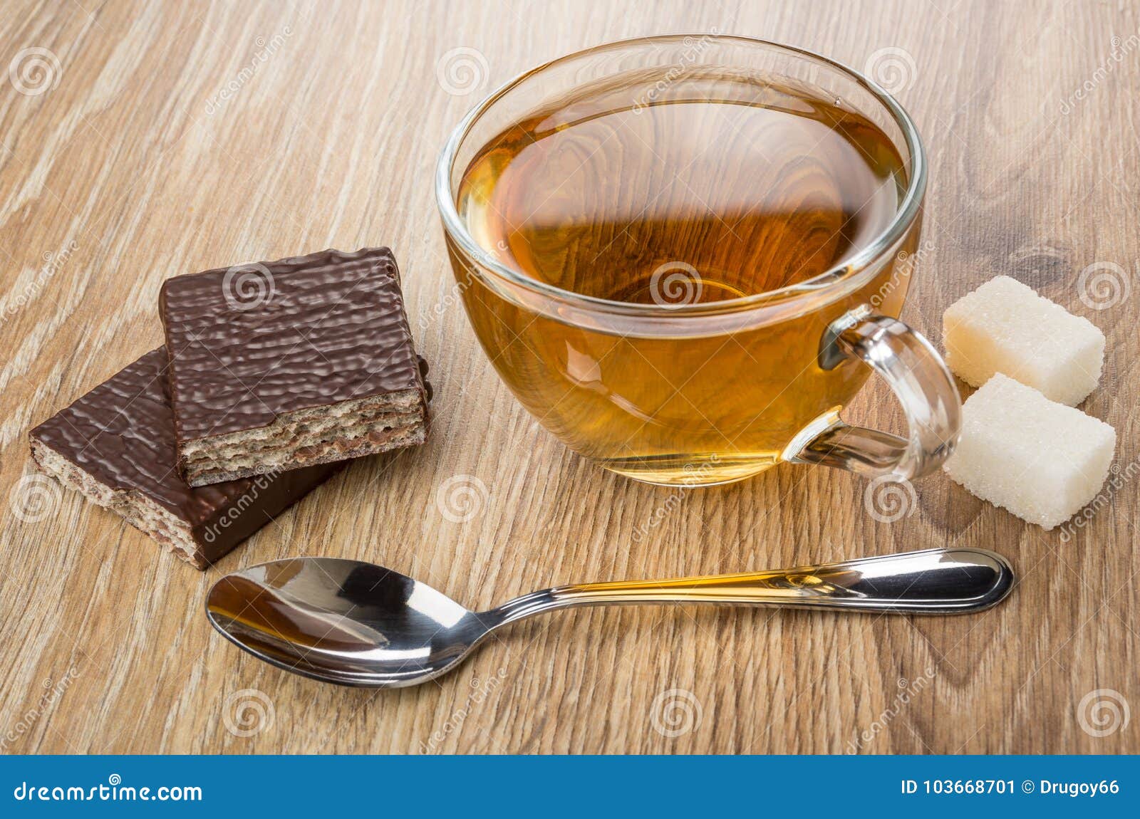 Cup of Tea, Spoon, Lumpy Sugar, Teaspoon and Broken Wafer Stock Image ...