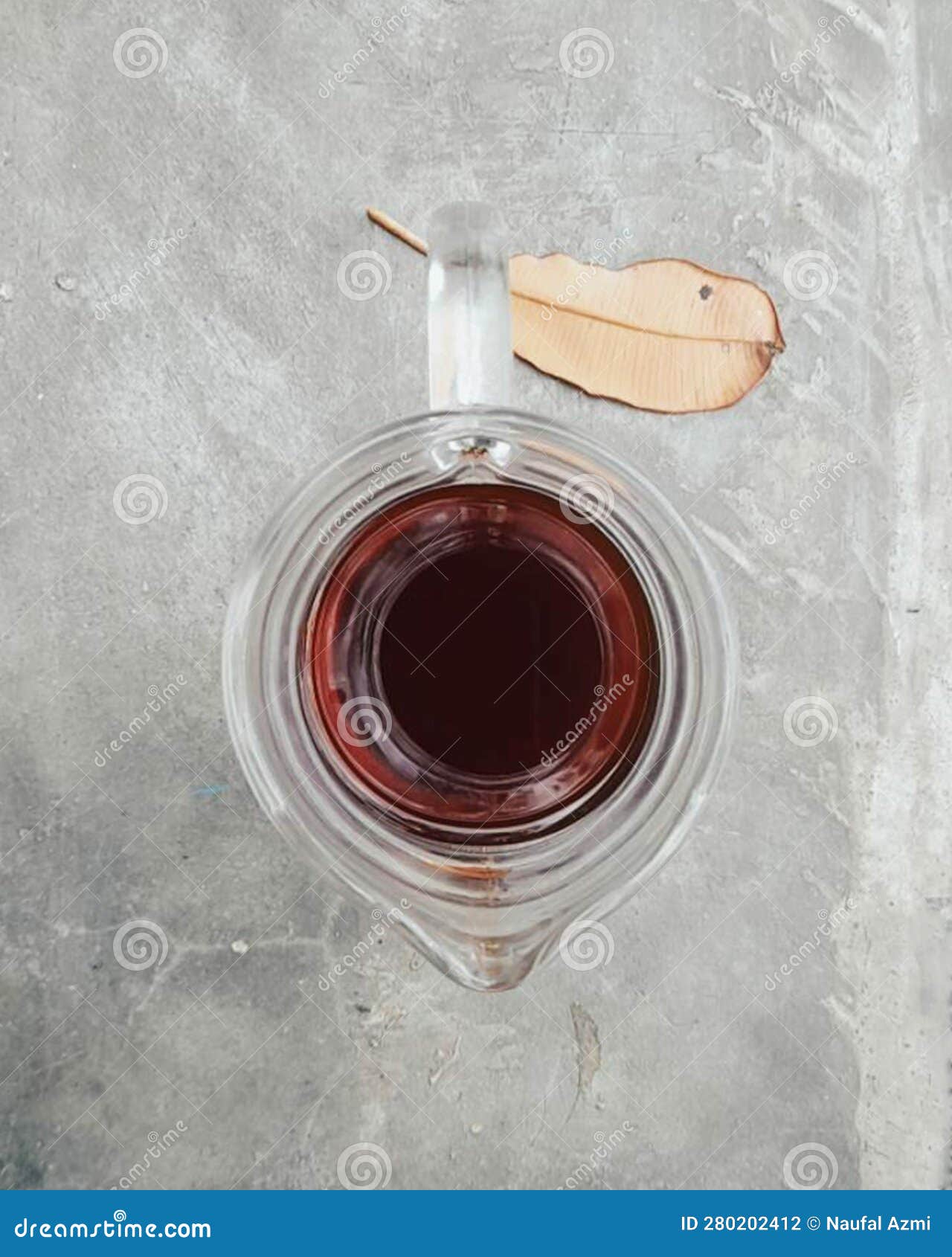 A CUP of V90 COFFEE with LEAF BESIDES Stock Photo - Image of pouring ...