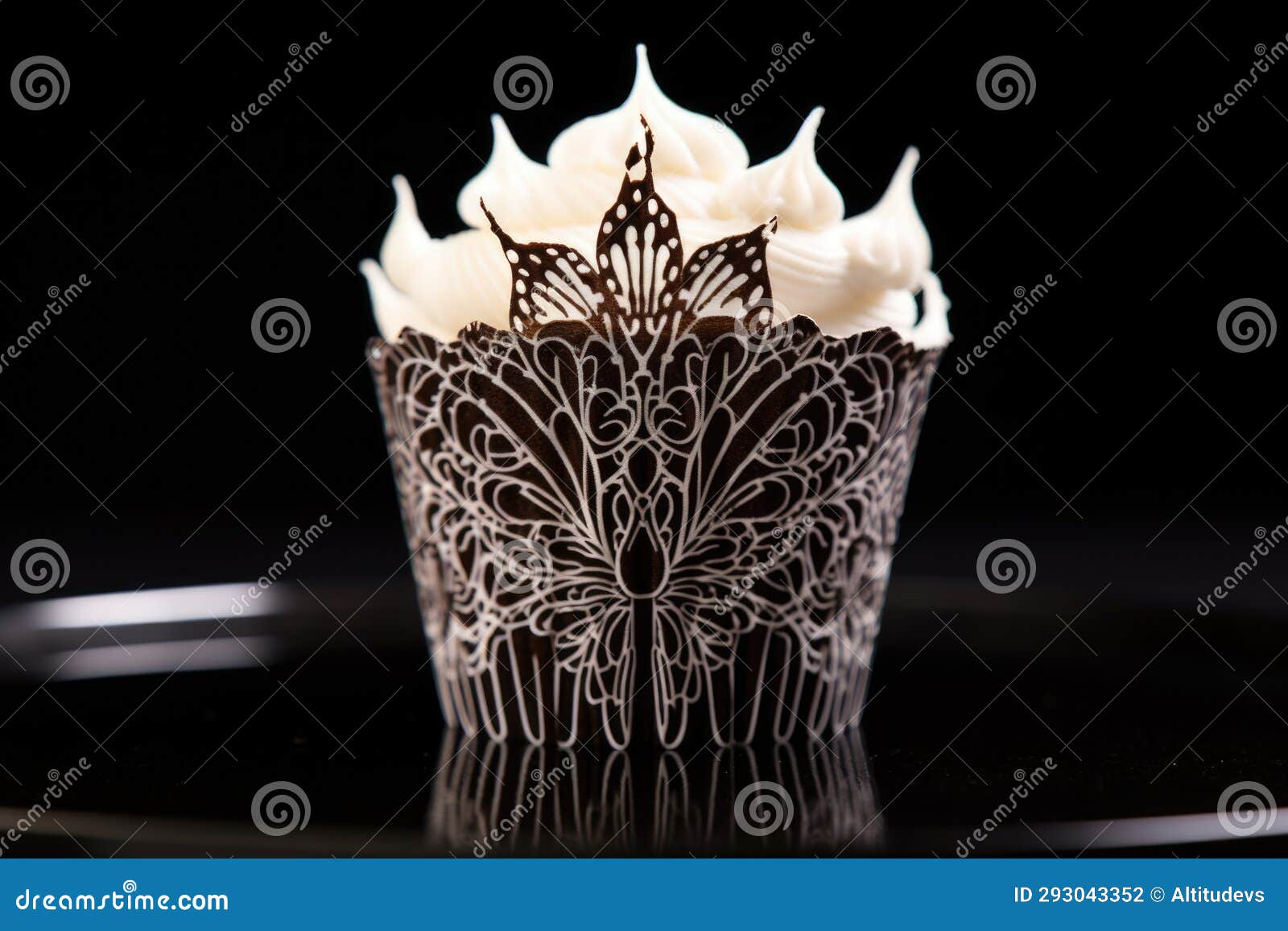 A Cupcake with a Complex Icing Design Set Against a Black Background ...