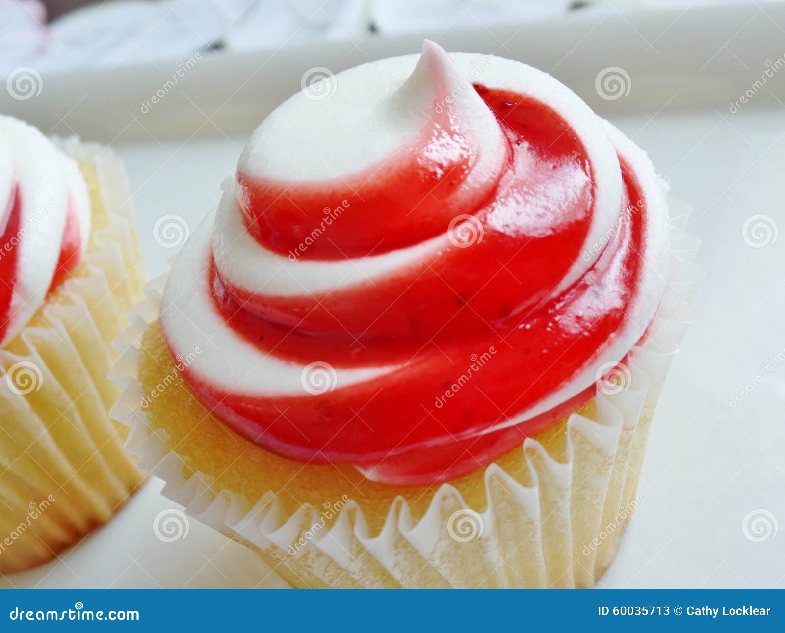 A Cupcake with Red and White Frosting Stock Image - Image of icing ...