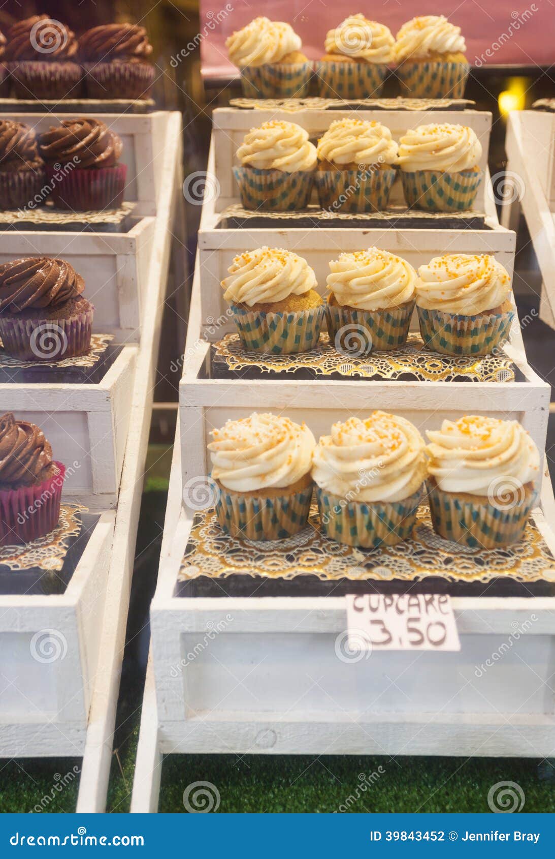 Cupcakes on Display in Shop Window Stock Photo - Image of display ...