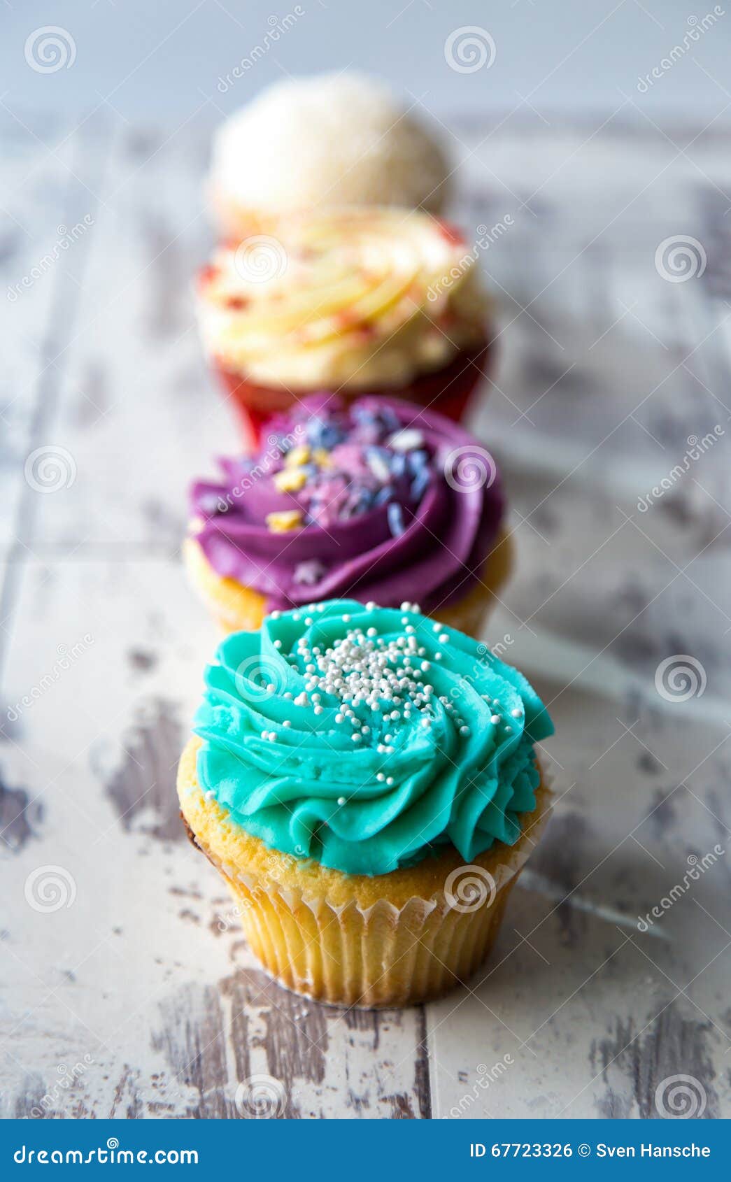 Cupcakes in a Row on Wooden Table Stock Photo - Image of delicious ...