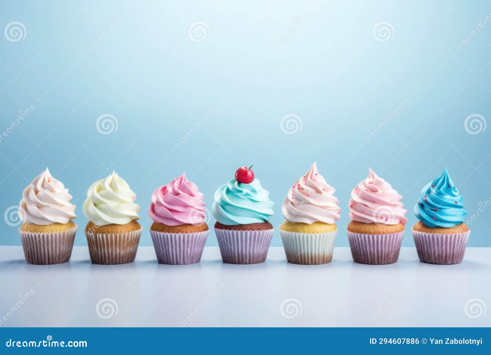 Cupcakes Standing on Gradient White Blue Background Wide Stock ...