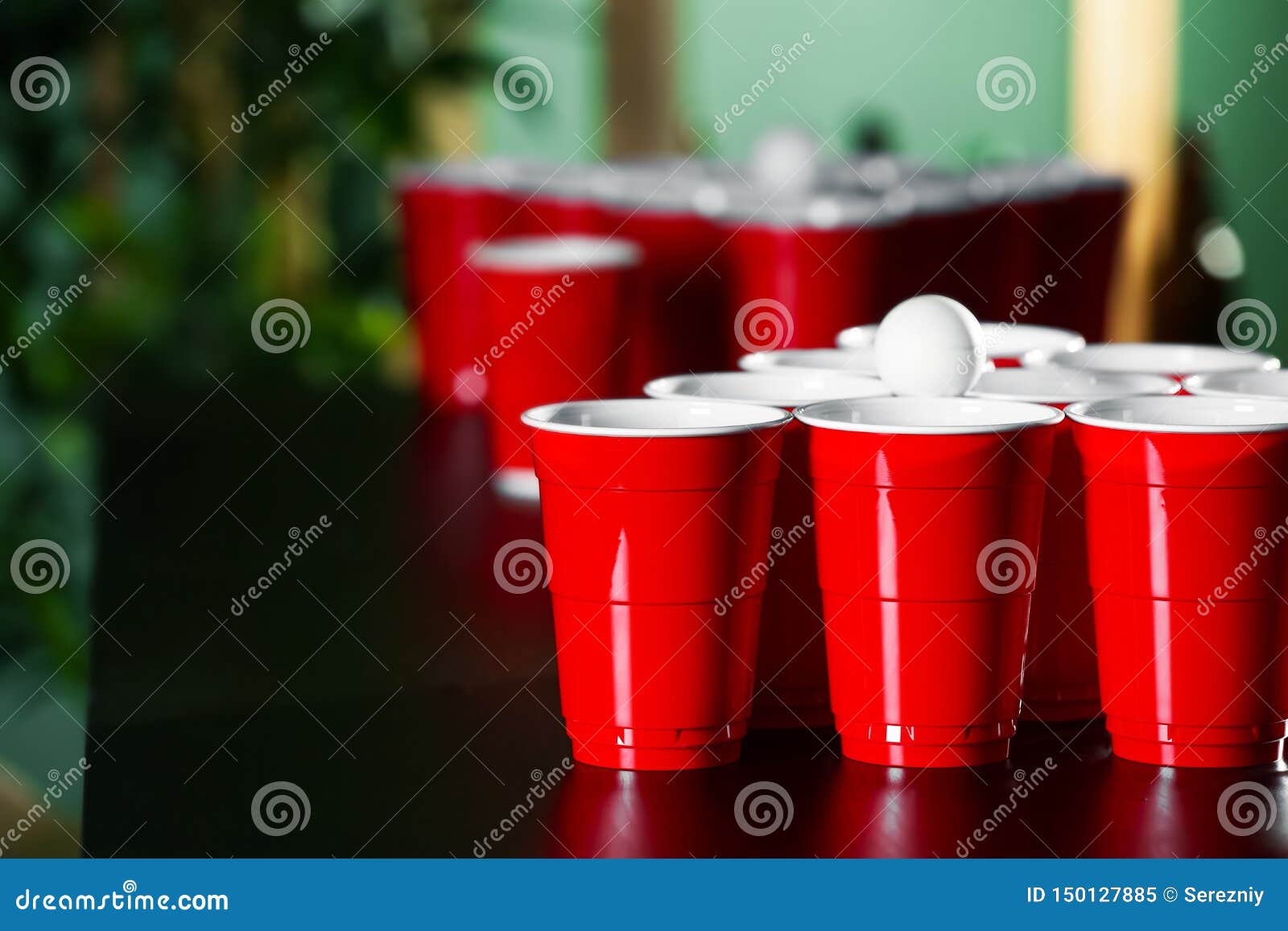 Cups and Plastic Ball for Beer Pong Game on Table Stock Image - Image ...