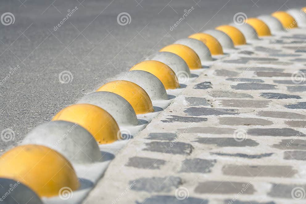 Curb Separated Asphalt Road and Cobblestone Stock Photo - Image of bent ...