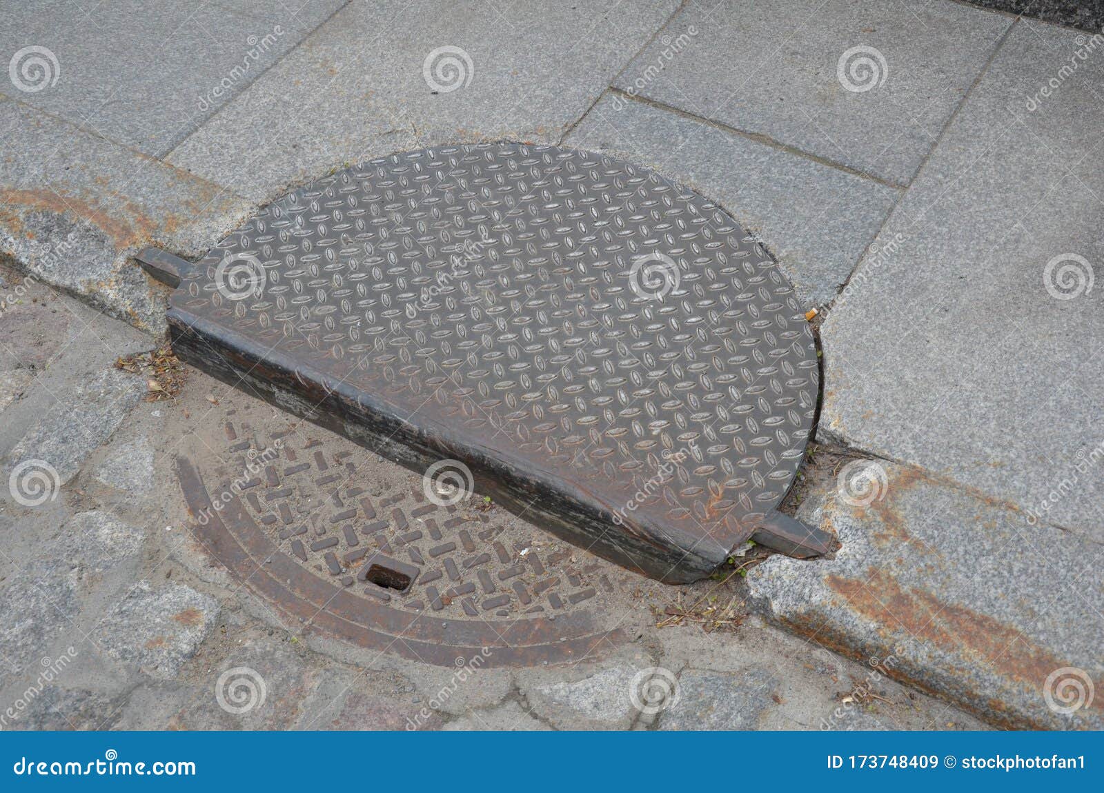 Curb with Sewer or Manhole Cover and Sidewalk Stock Image - Image of ...