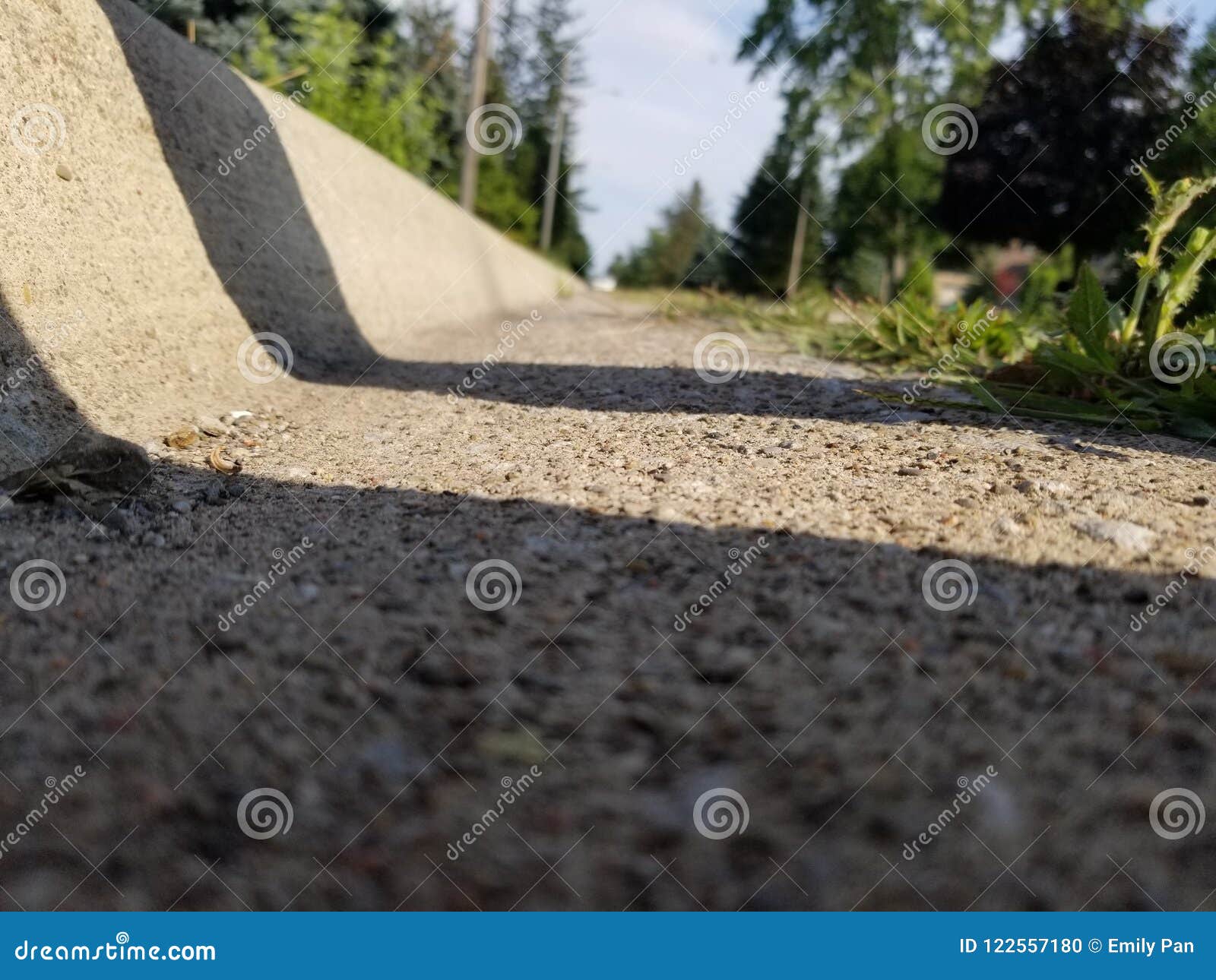 A Curb View stock photo. Image of legs, view, curb, shadow - 122557180