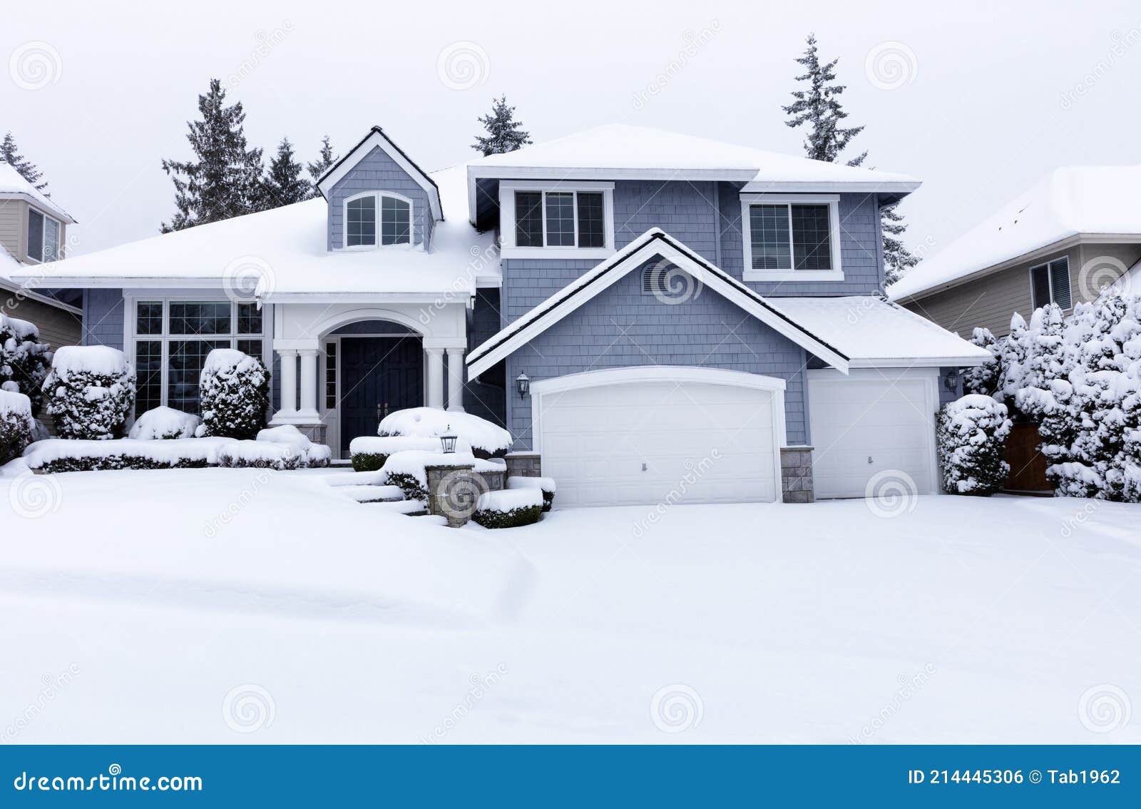 Curbside View of Home during Winter Snowstorm with Light Snow Coming ...