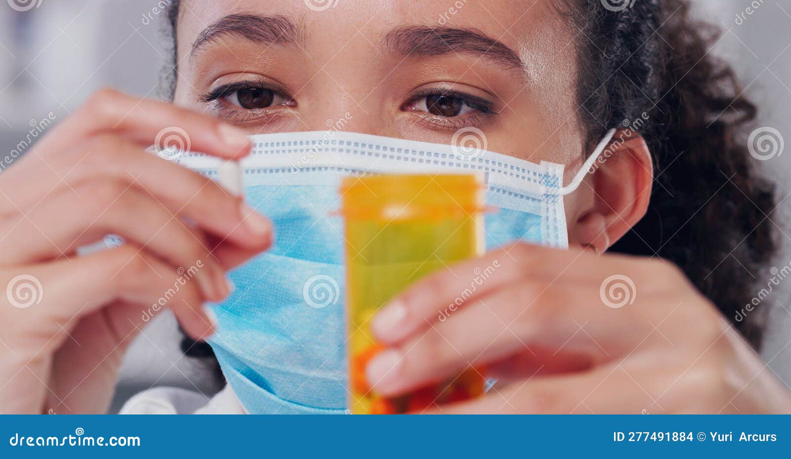 This Cure Will Save Many Lives. a Young Scientist Holding a Pill in Her ...