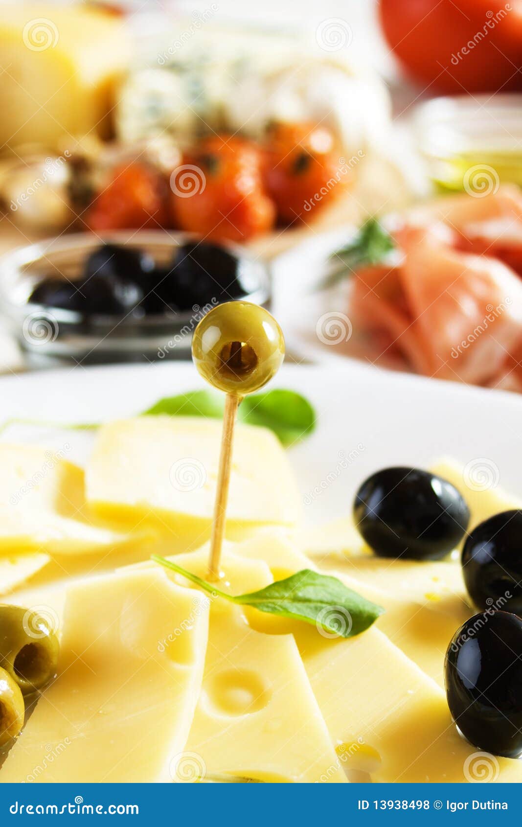 Cured cheese with olives stock photo. Image of meal, emmental - 13938498
