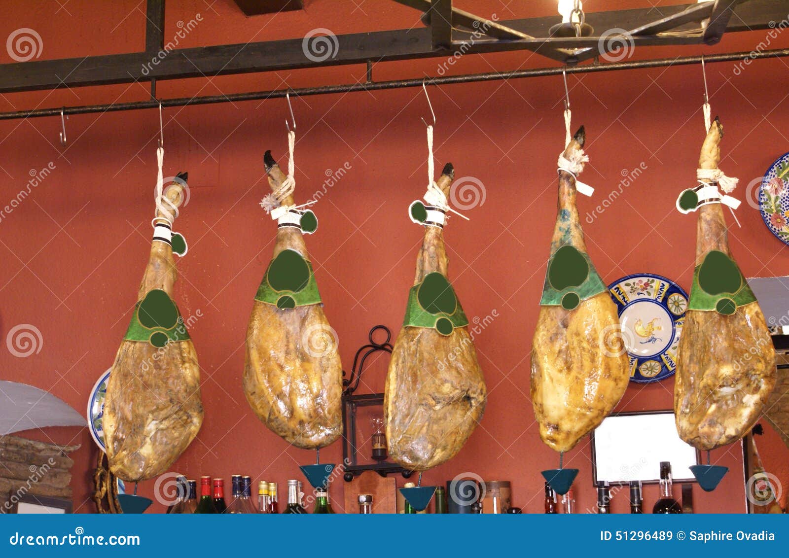 Cured Meat Hanging from Meat Hooks on a Rail Stock Image - Image of ...