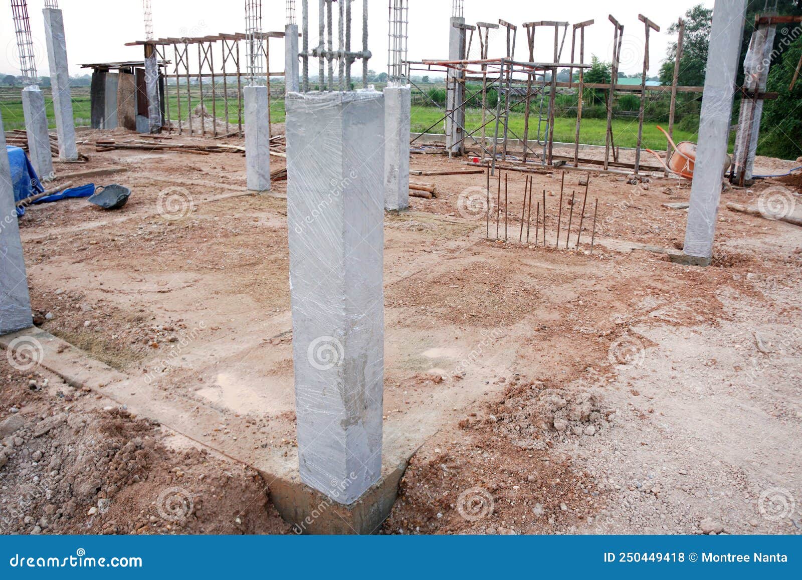 Concrete Columns at the Construction Site are Covered with Plastic ...