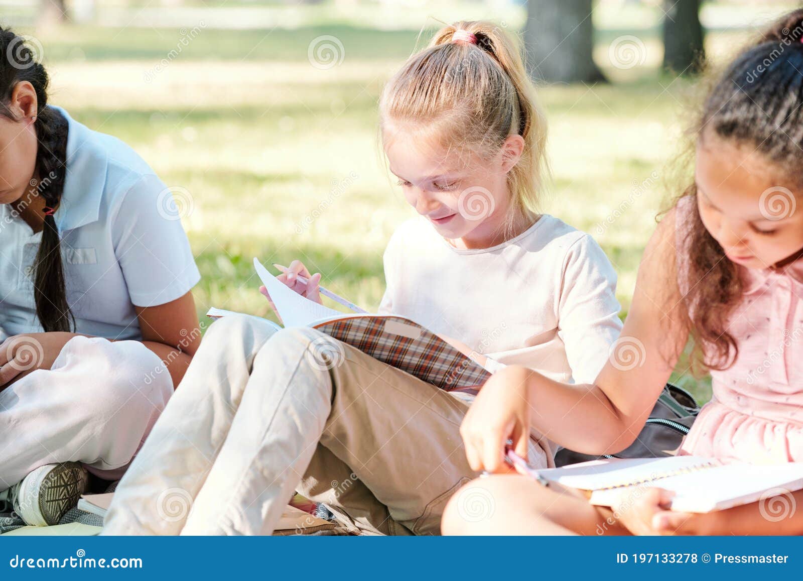 Curious Girl Checking Notes in Workbook Stock Photo - Image of ...