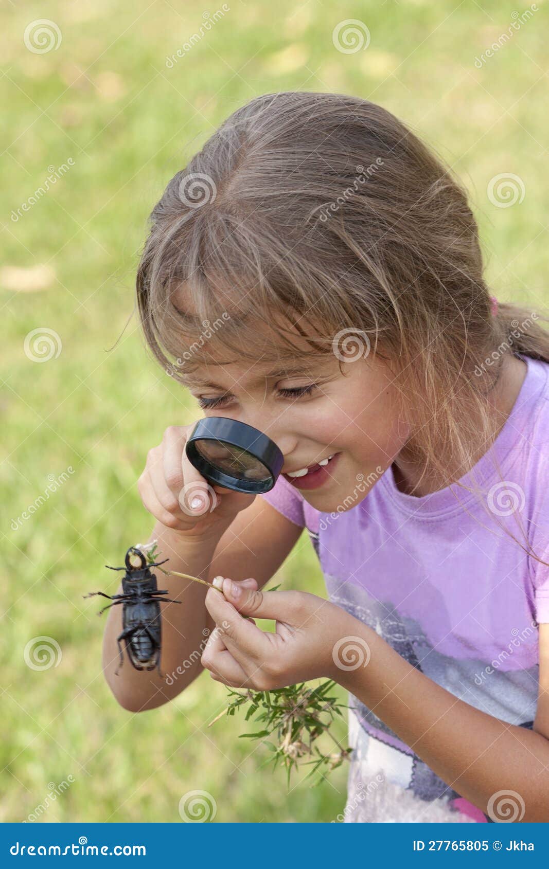Curious Girl Looking at Beetle Stock Image - Image of face ...