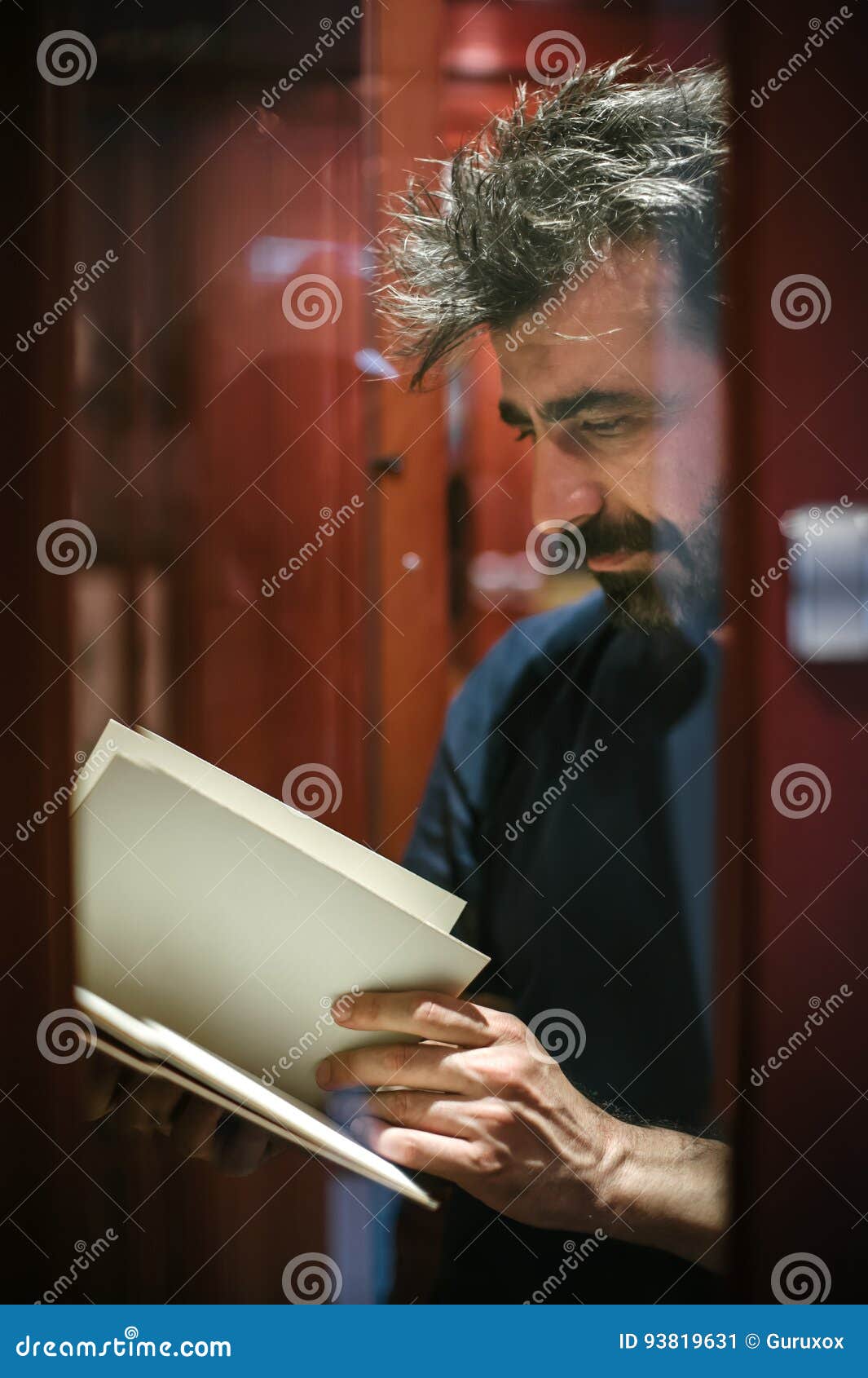 Curious Man Choosing Book in His Library at Home Stock Image - Image of ...