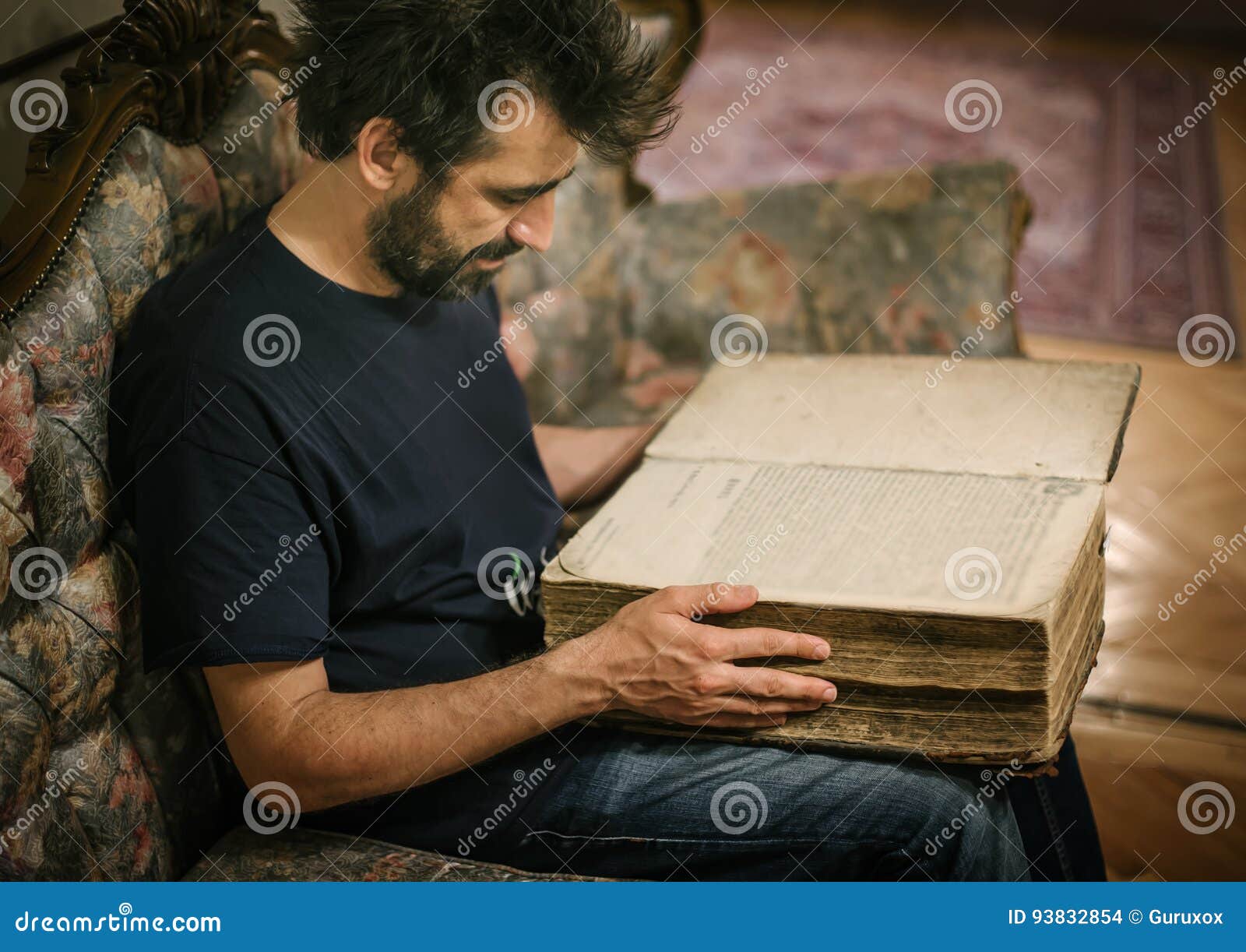 Curious Man Reading Old Book in His Library at Home Stock Photo - Image ...