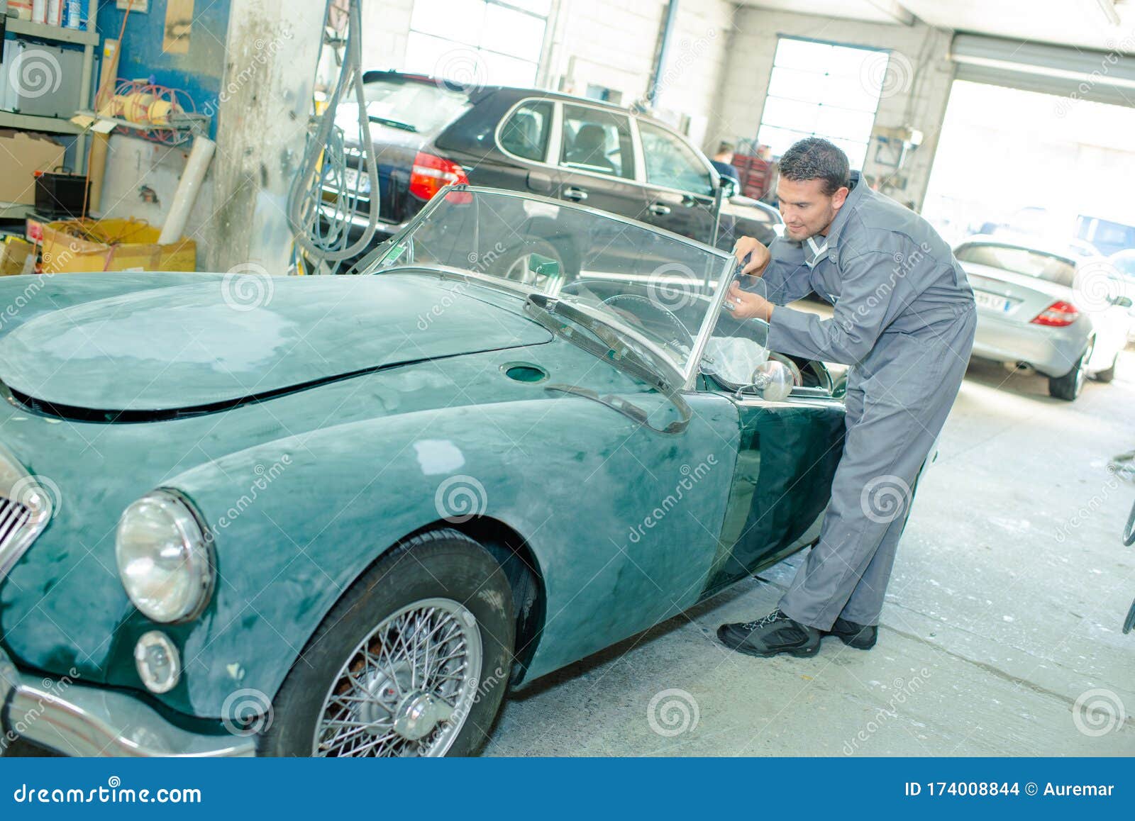Curious mechanic at work stock photo. Image of road - 174008844