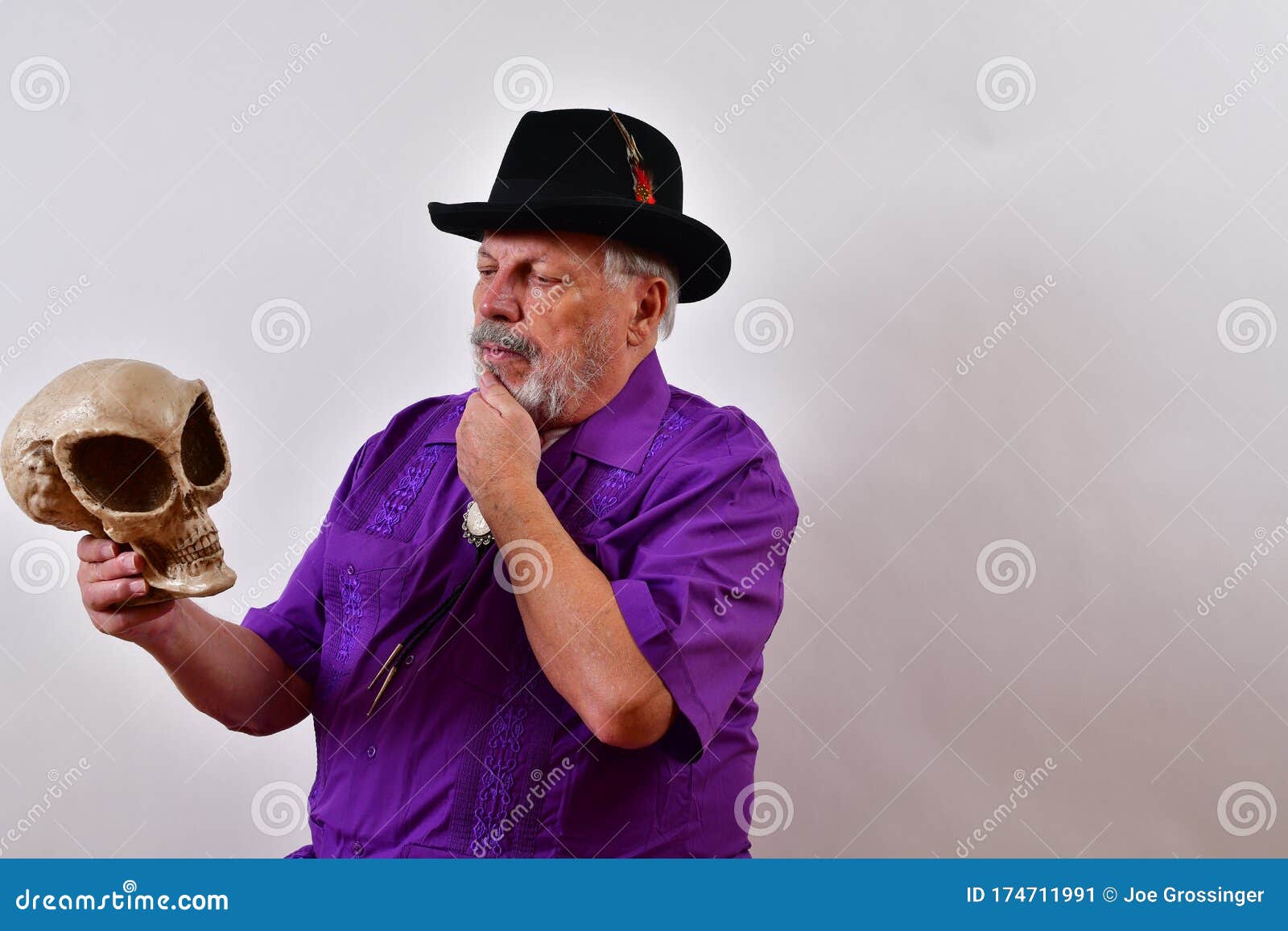 Curious Old Man Studying an Alien Skull Stock Image - Image of holding ...