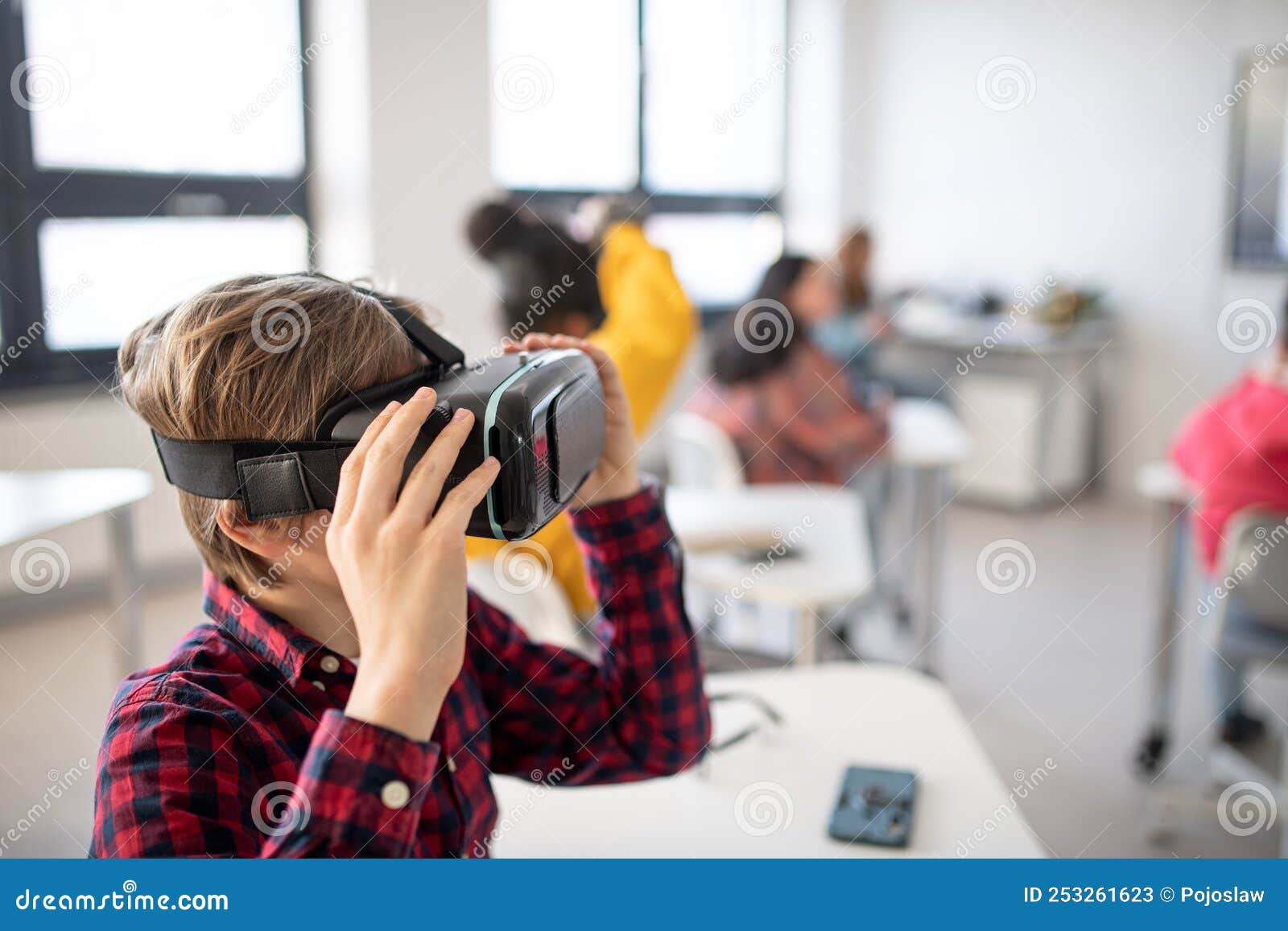 Curious Student Wearing Virtual Reality Goggles at School in Computer ...