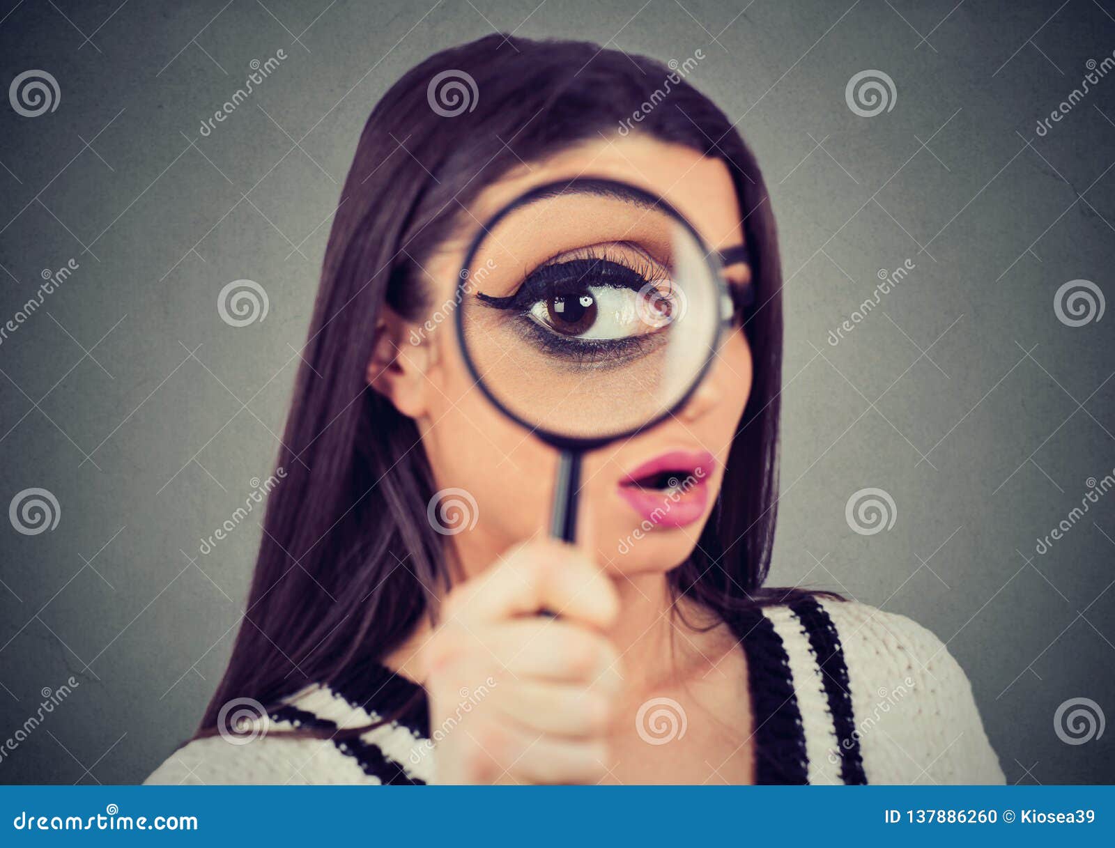 Curious Woman Looking through a Magnifying Glass Stock Photo - Image of ...