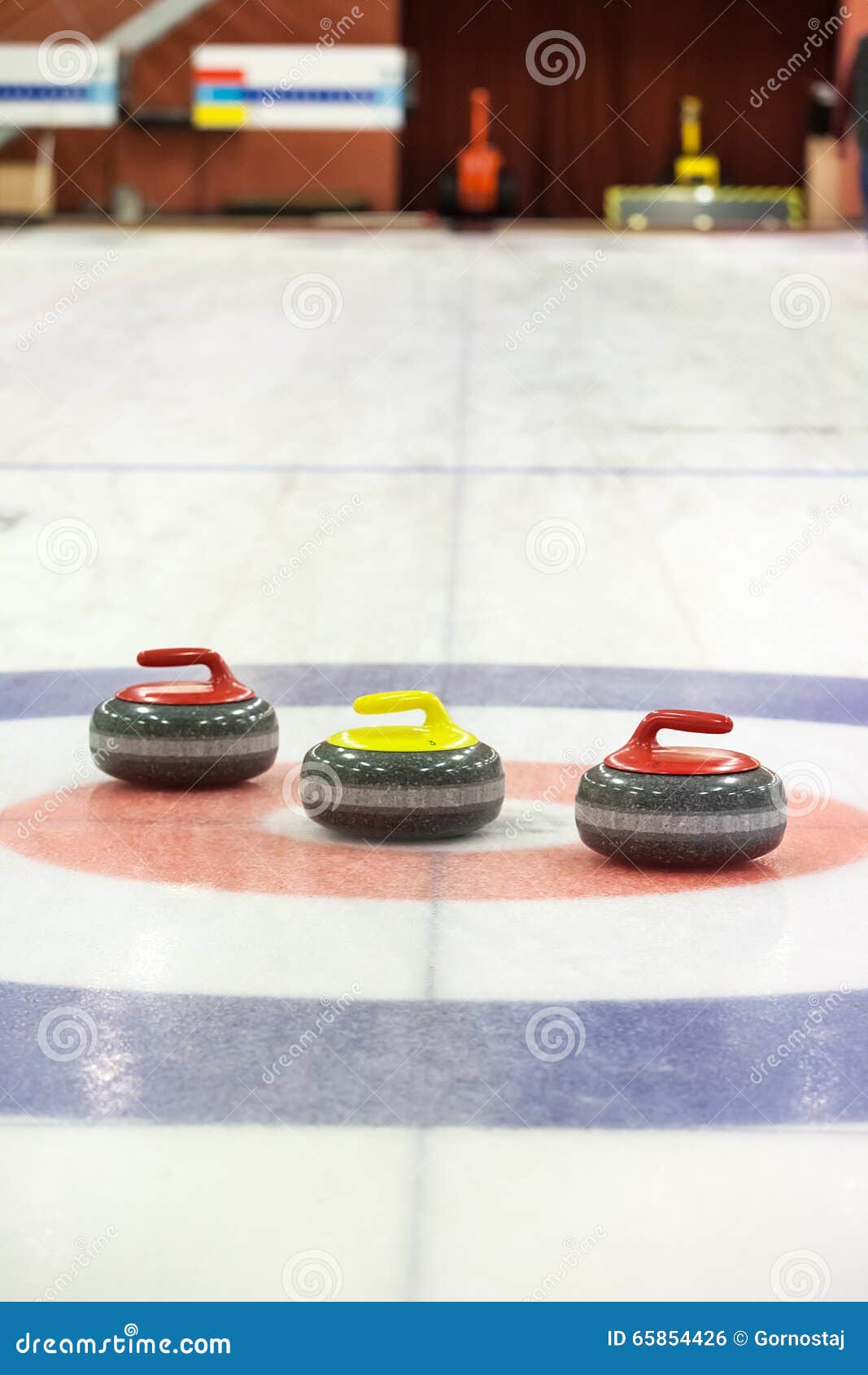 Curling rocks on ice stock photo. Image of people, legs - 65854426