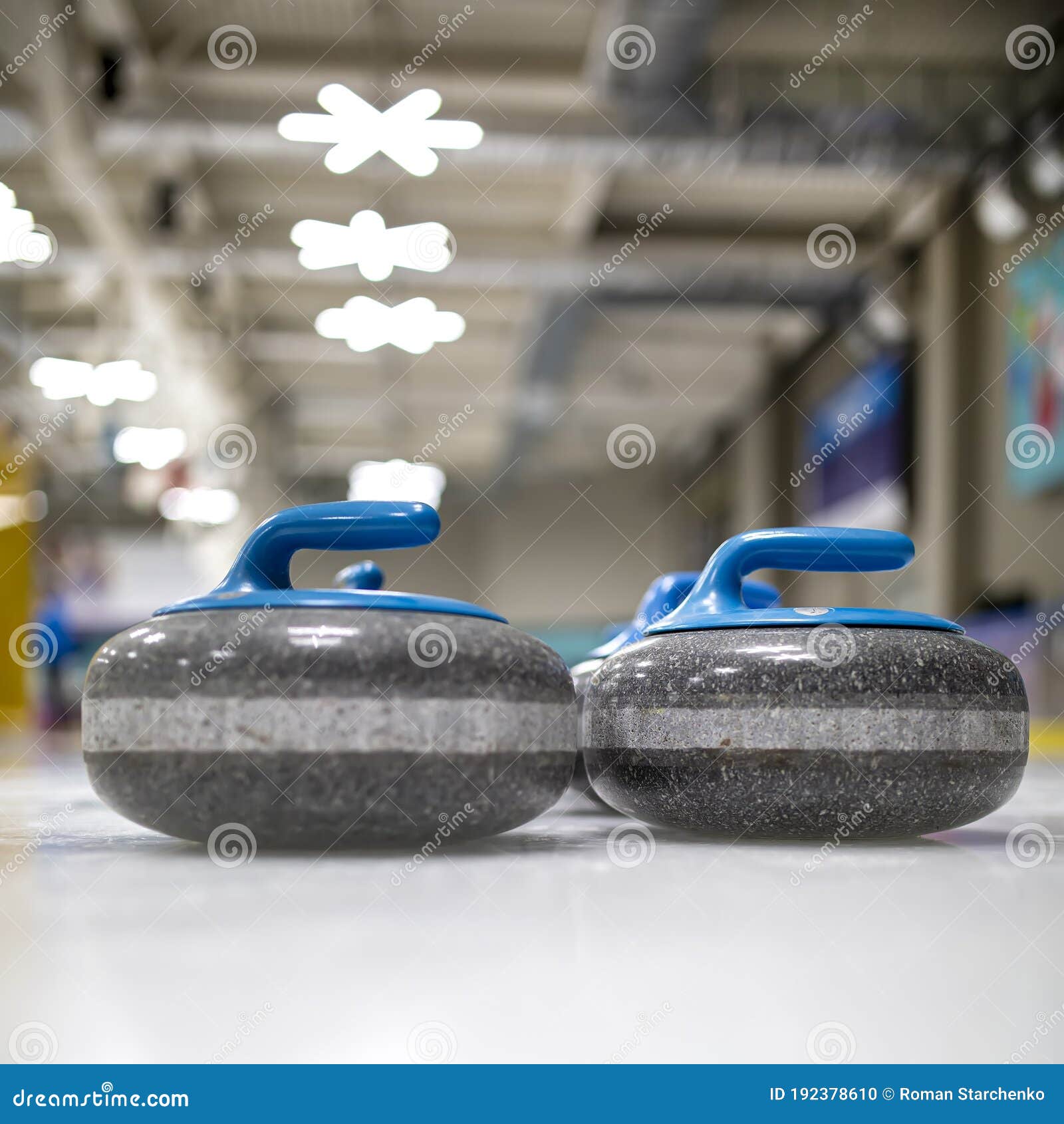 The Curling Stone or Rock is Made of Granite with Blue Handles Lie ...