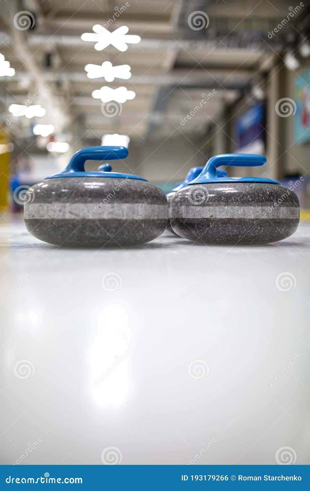 The Curling Stone or Rock is Made of Granite with Blue Handles Lie ...