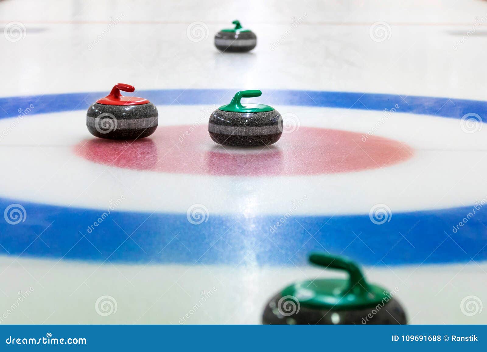 Curling stones on the ice stock photo. Image of white - 109691688