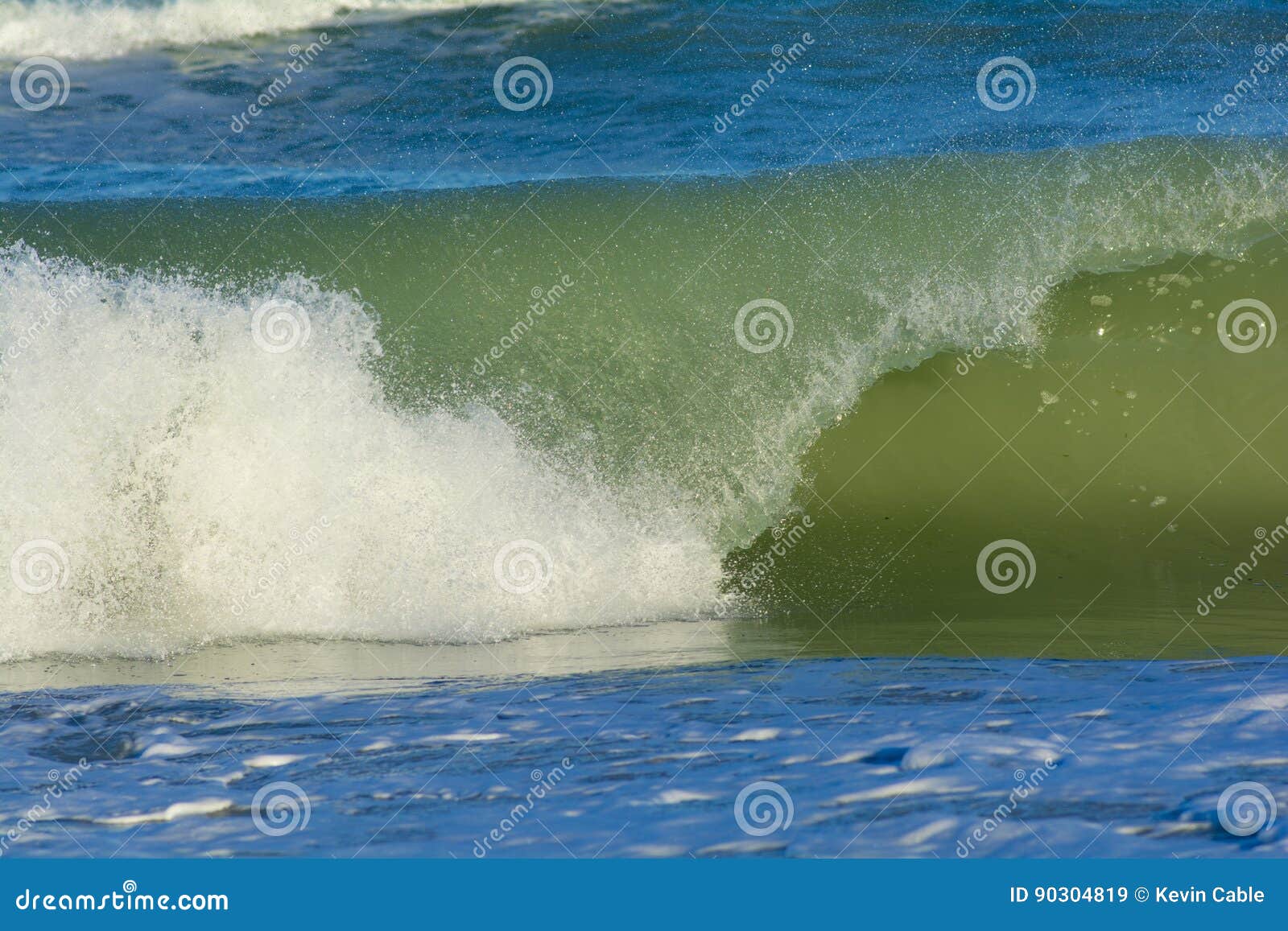 Curling waves at the beach stock image. Image of splashing - 90304819