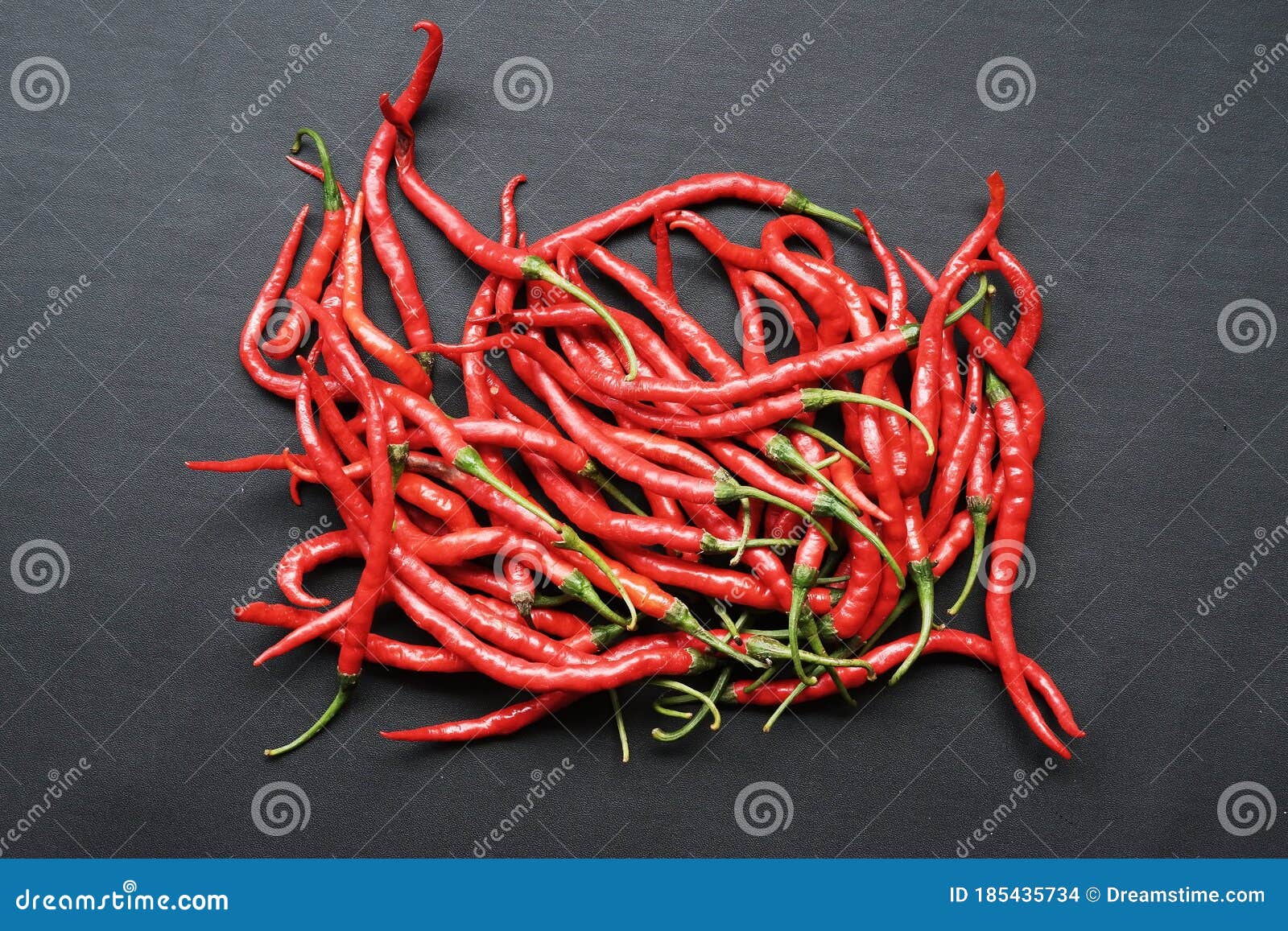 Curly Chili Pepper on Black Isolated Background Stock Photo - Image of ...