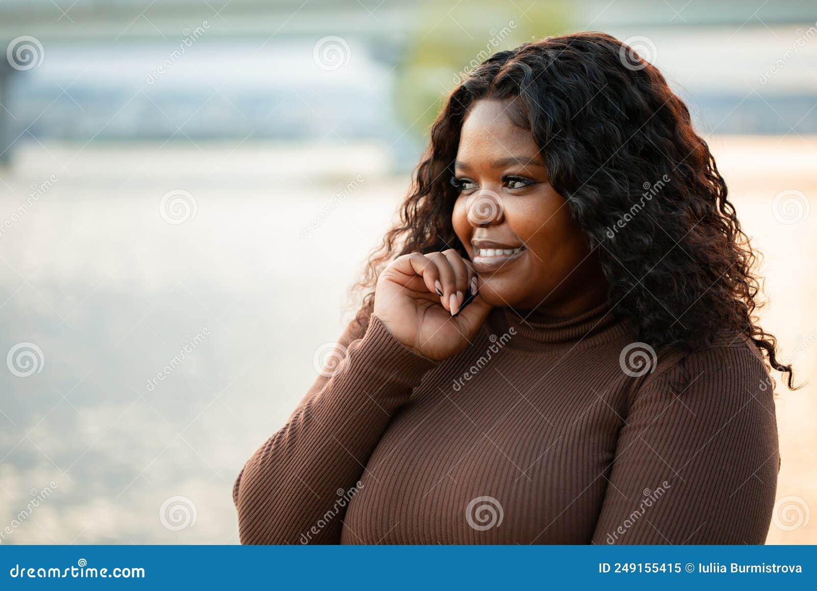 Curly Cute Dark Haired Smiling Pleasant And Modern African American