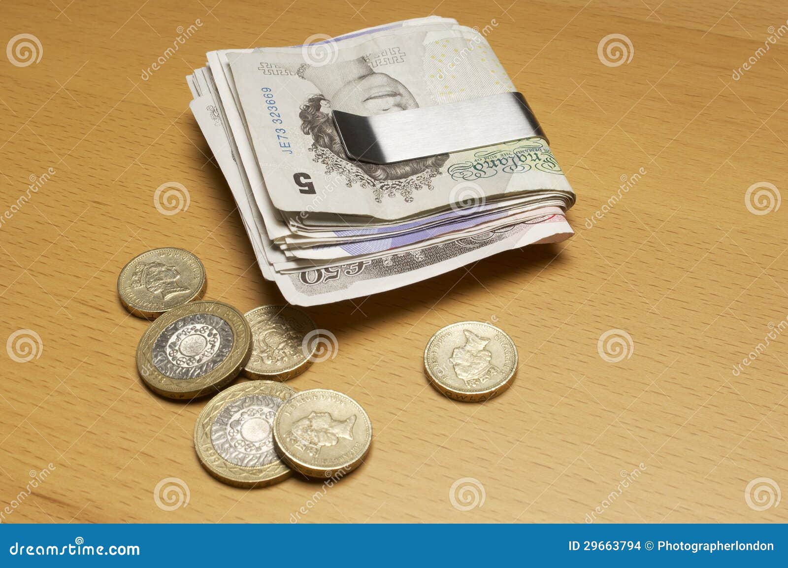 Currency in Money Clip and Coins on Table Editorial Stock Image - Image ... Currency in Money Clip and Coins on Table Editorial Stock Image - Image ...