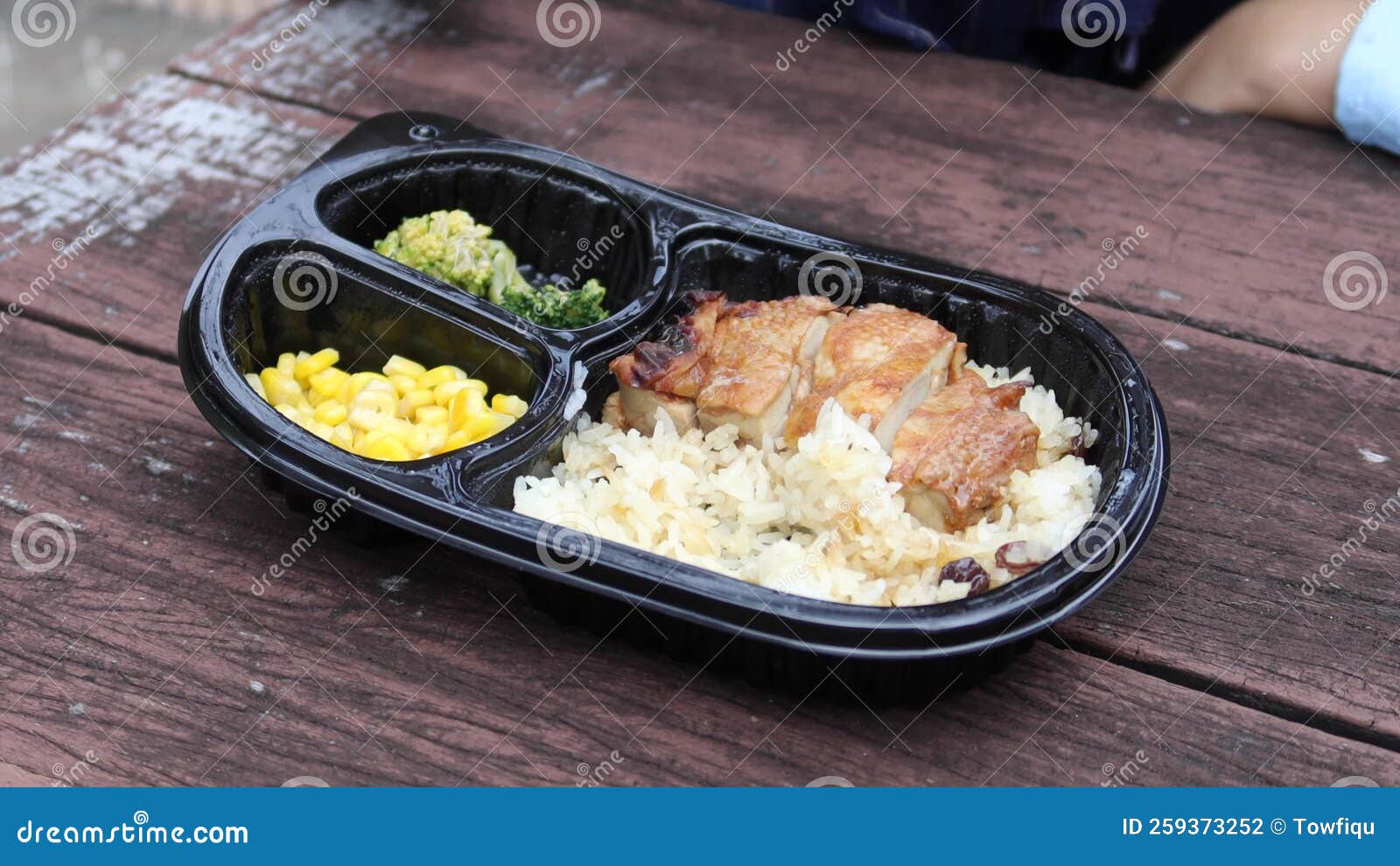 Curry Chicken and Rice in a Take Away Plastic Packet on Table Stock ...