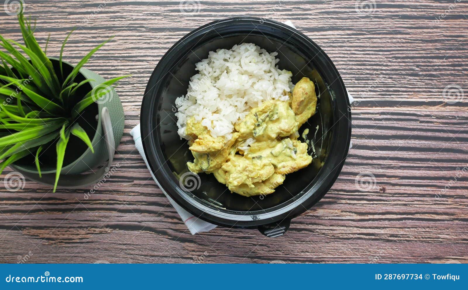Curry Chicken and Rice in a Take Away Plastic Packet on Table Stock ...