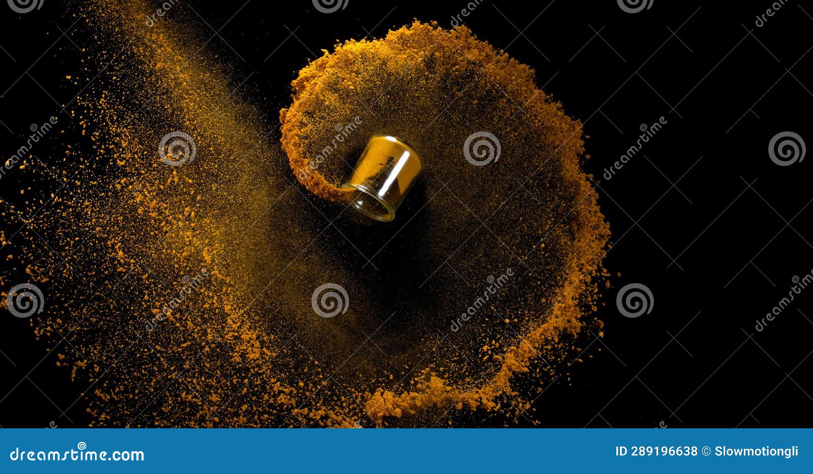 Curry Powder into a Small Jar Falling Against Black Background Stock ...