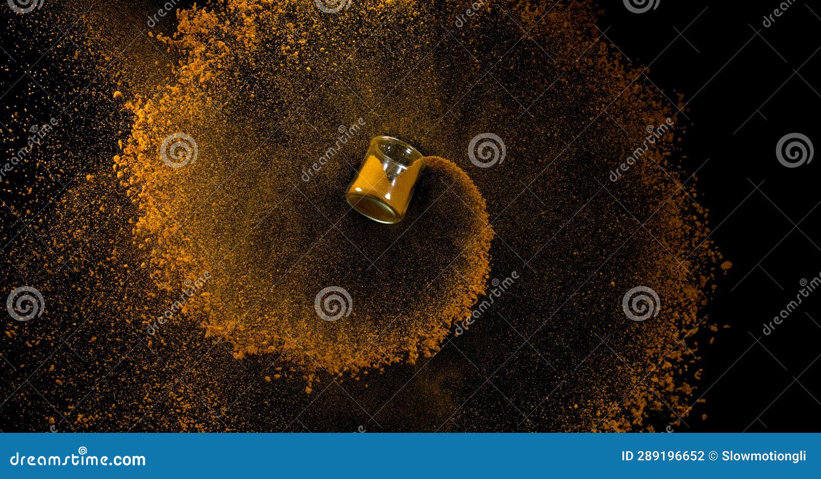 Curry Powder into a Small Jar Falling Against Black Background Stock ...