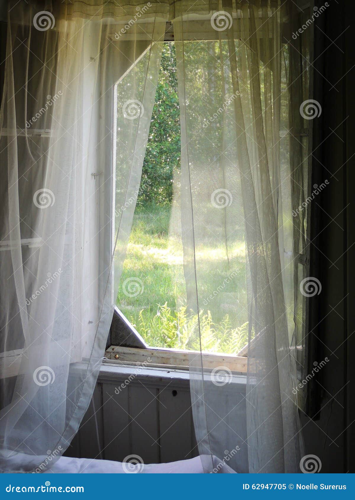 Open Window With Curtains Blowing