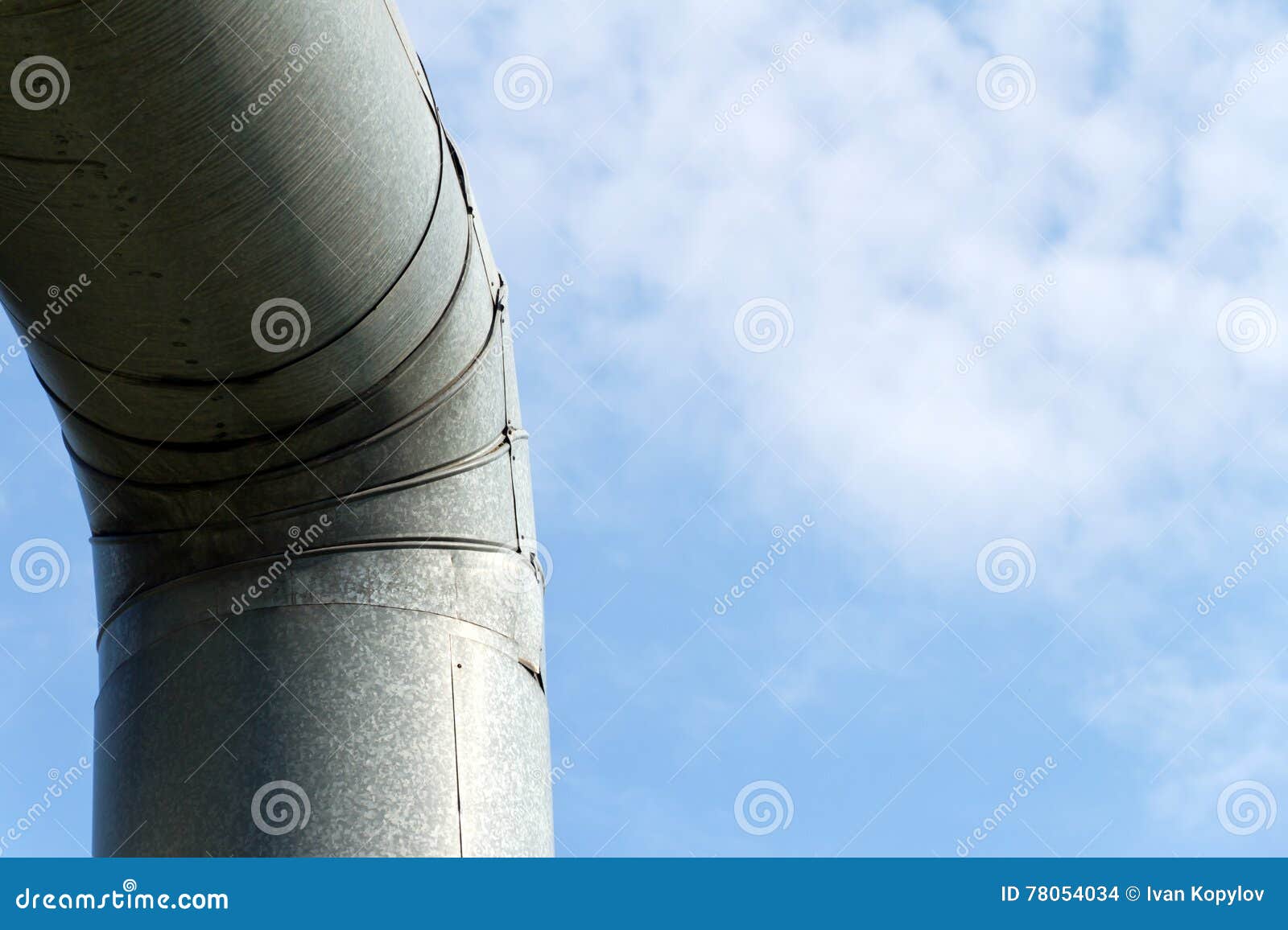 Curve Old Pipe on a Background of Blue Sky with White Clouds. Stock ...