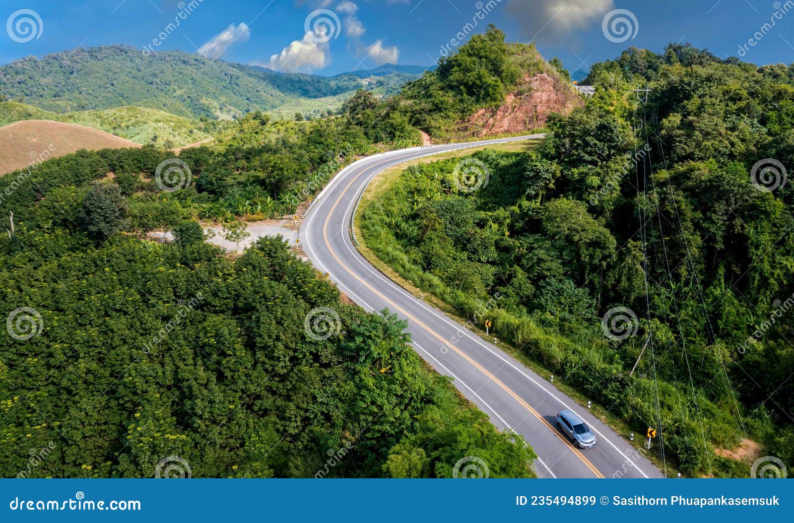 The Curve Road Trough the Green Forest with the Nature Landscape with ...