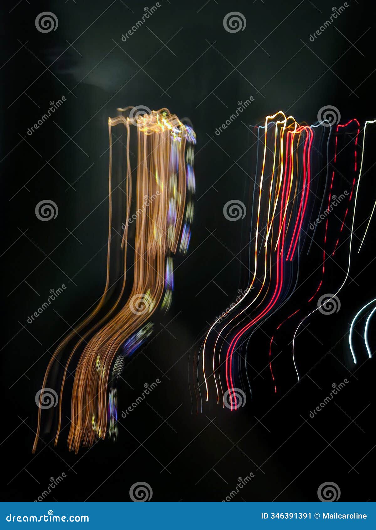 Curved Abstract Multicolor Light Rays Against a Dark Hazy Background ...